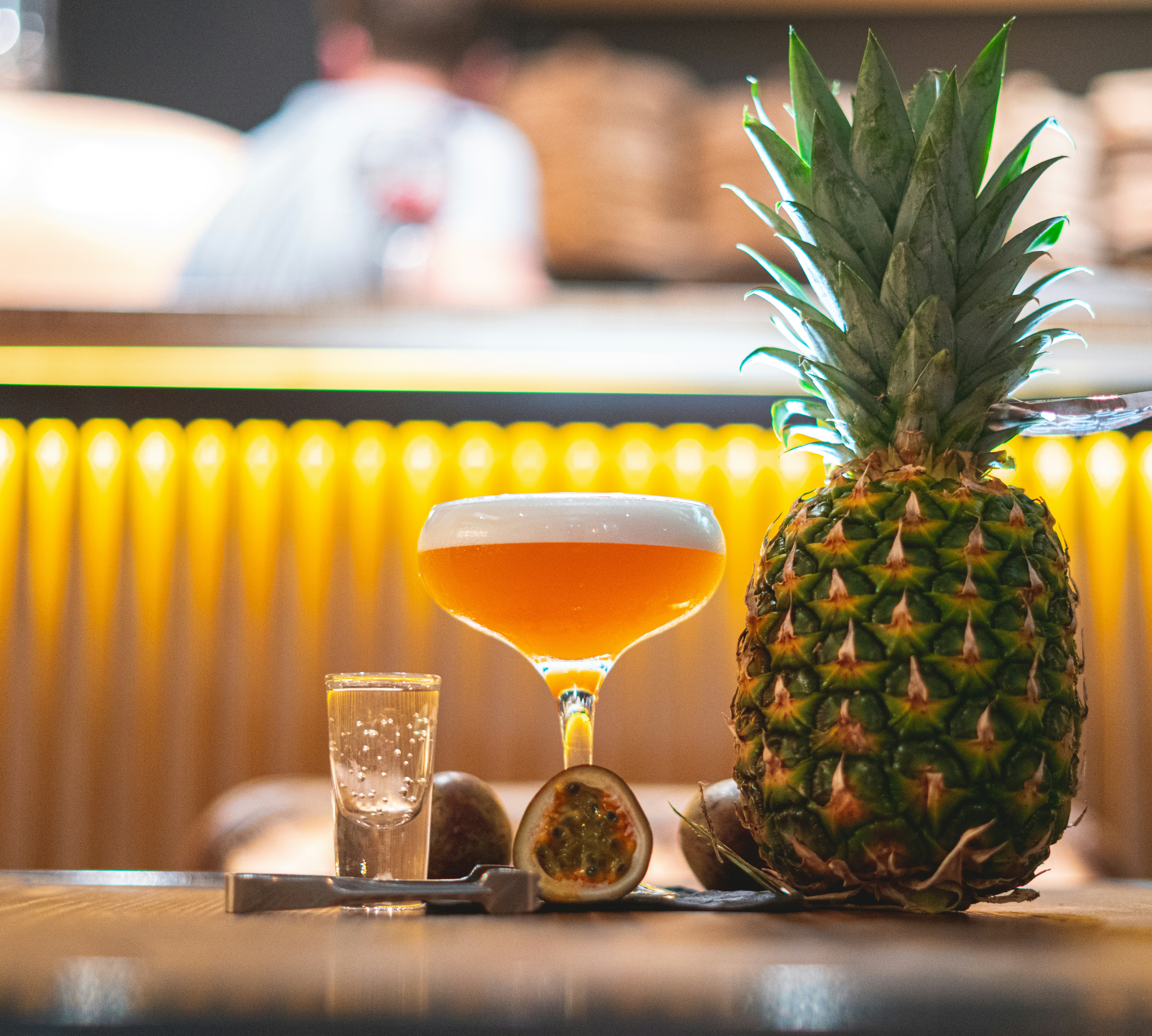Amber Crown at the Bar: Pineapple and Cocktail in Warm Spotlight