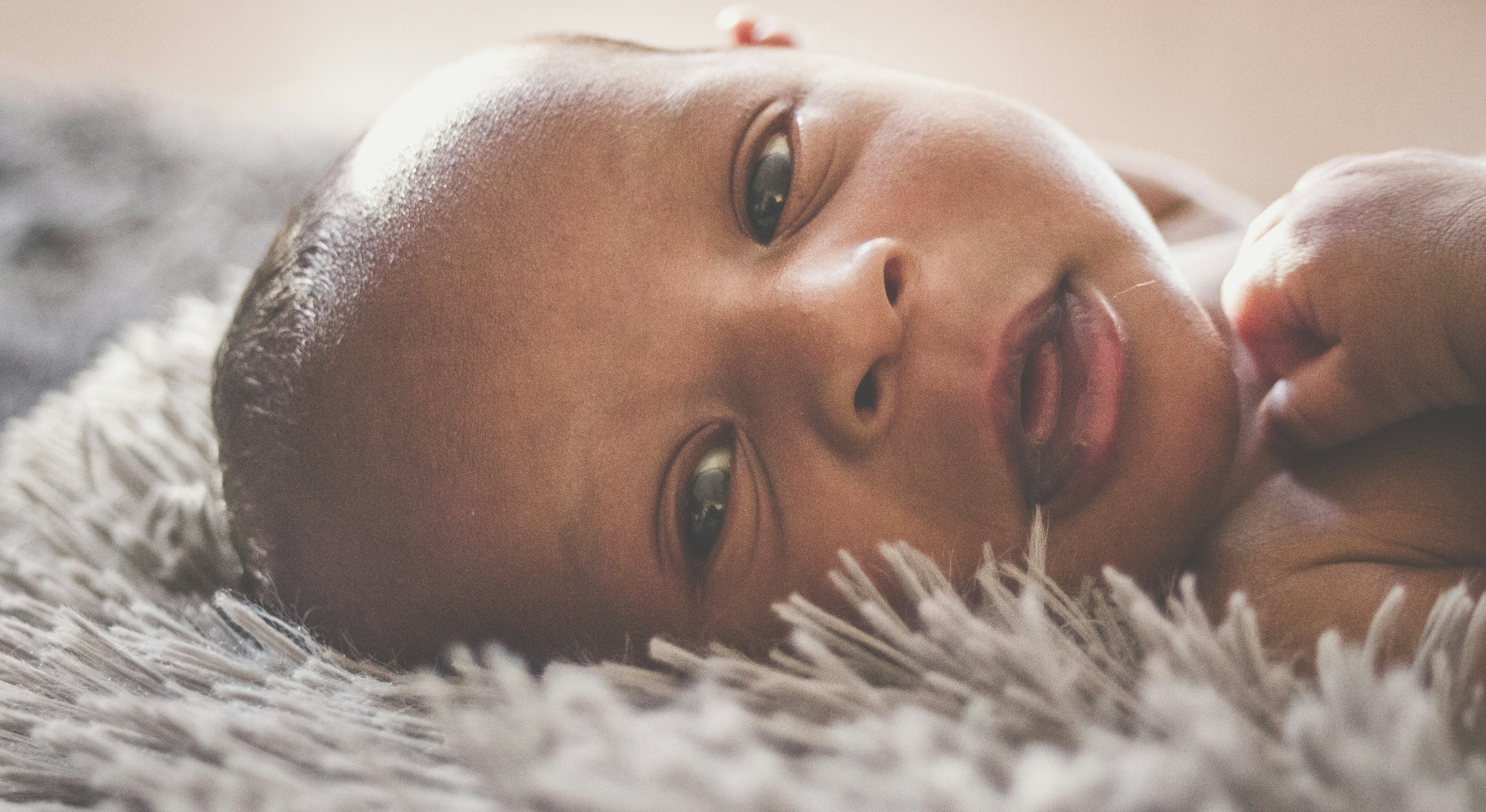 a person lying on a blanket