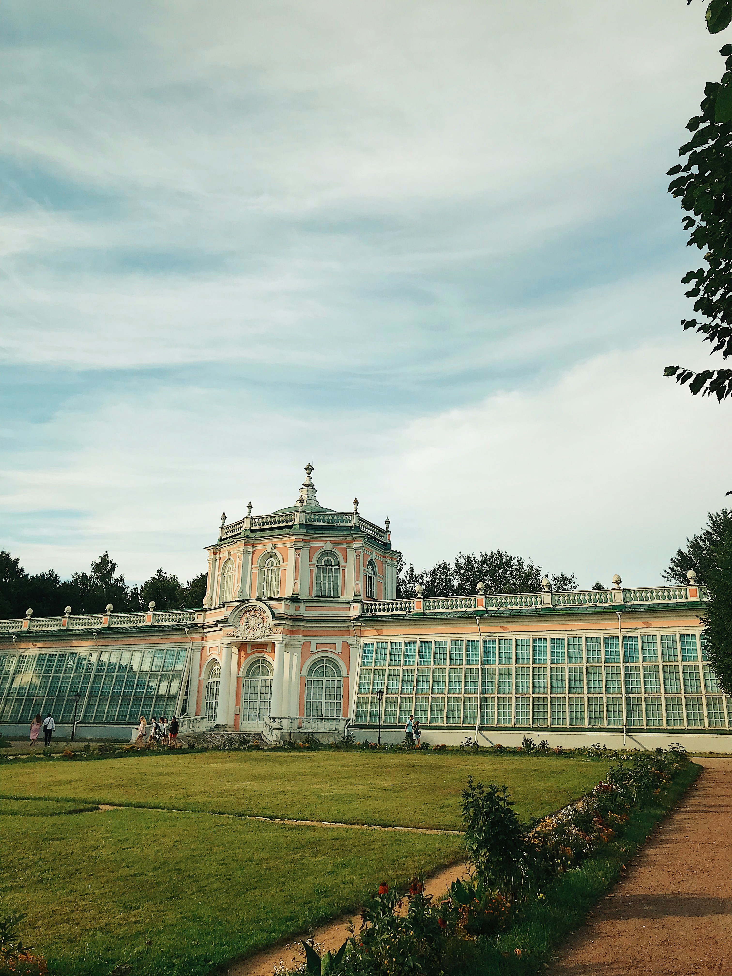 Rosy Glass Pavilion in a Sunlit Garden