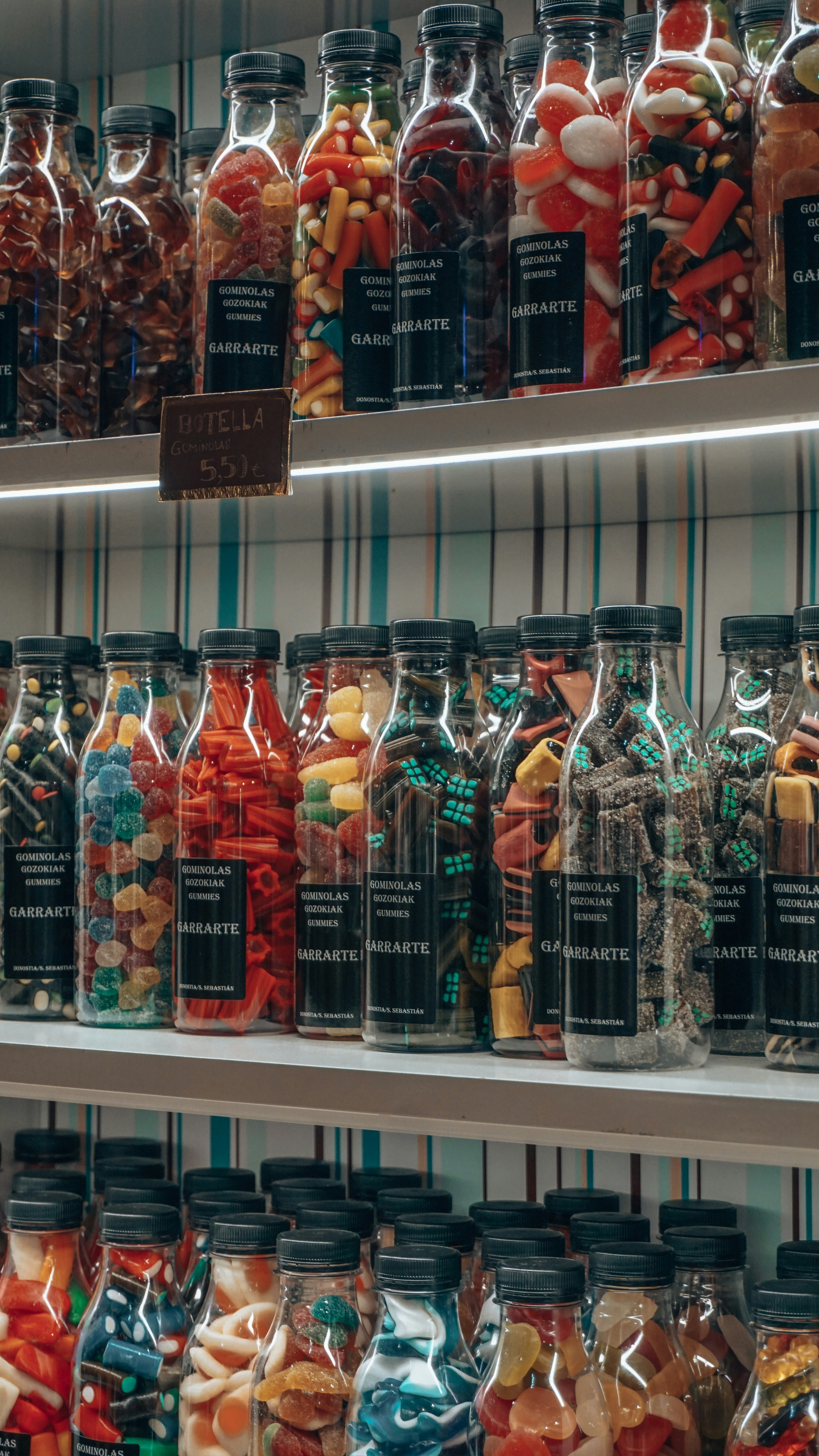 a shelf of bottles of alcohol