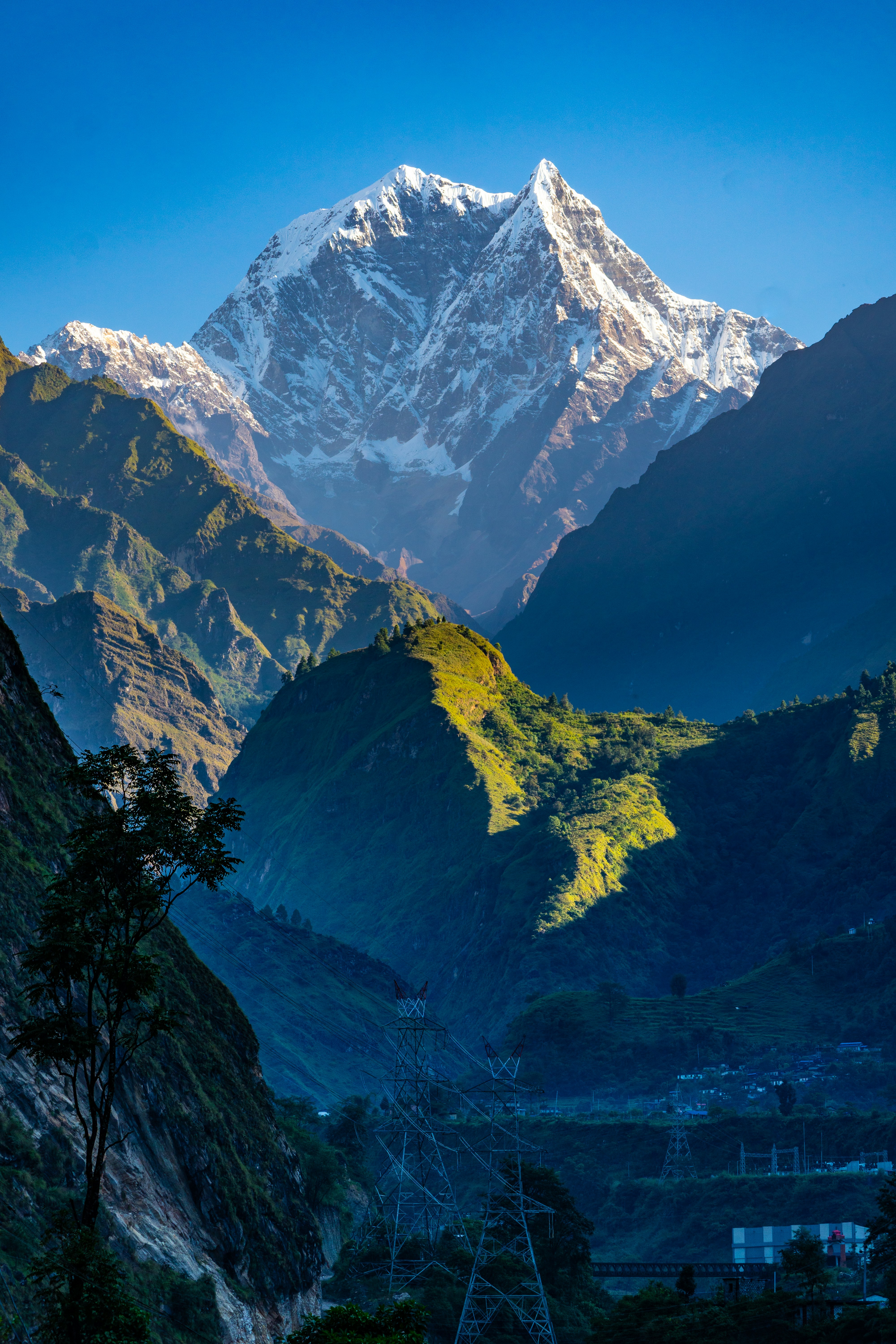 Snow-Crowned Summit Over Sunlit Valleys