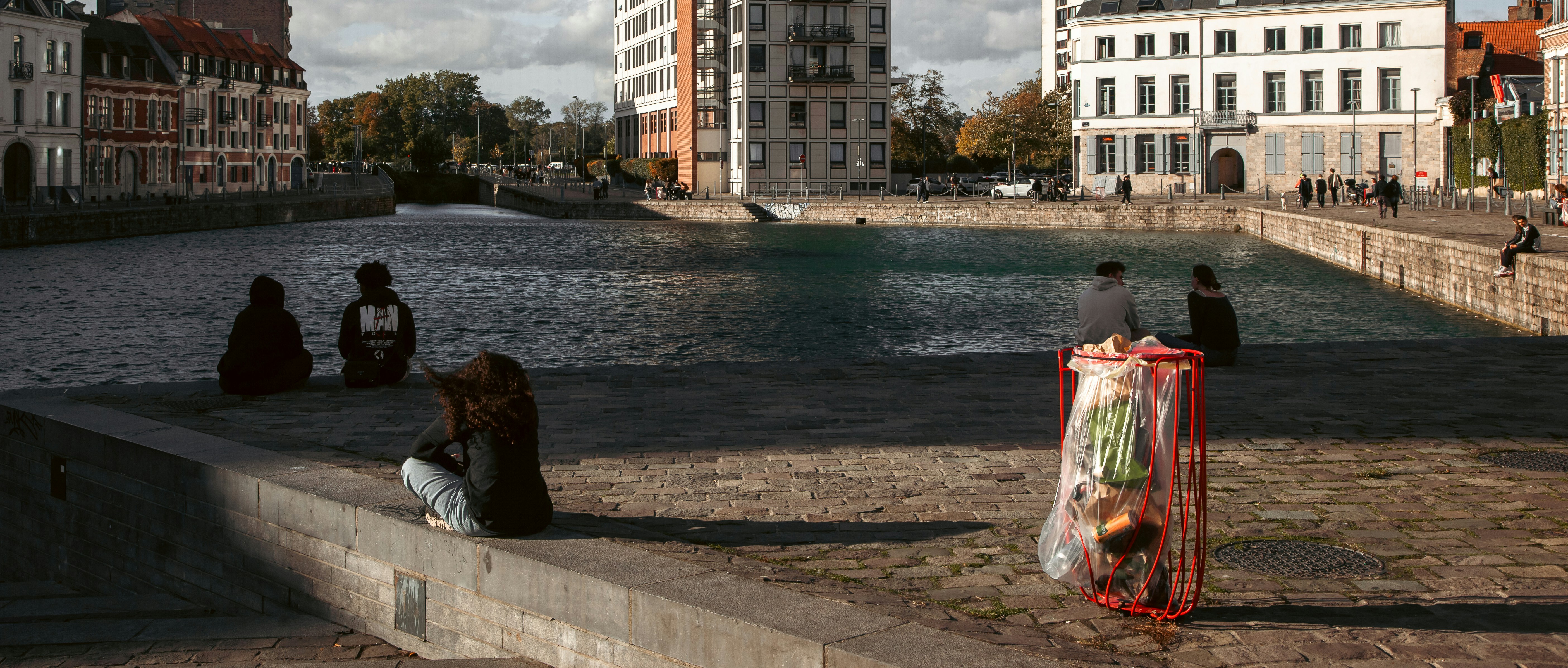 Red Bin by the Canalfront: Afternoon Quiet on Stone Steps