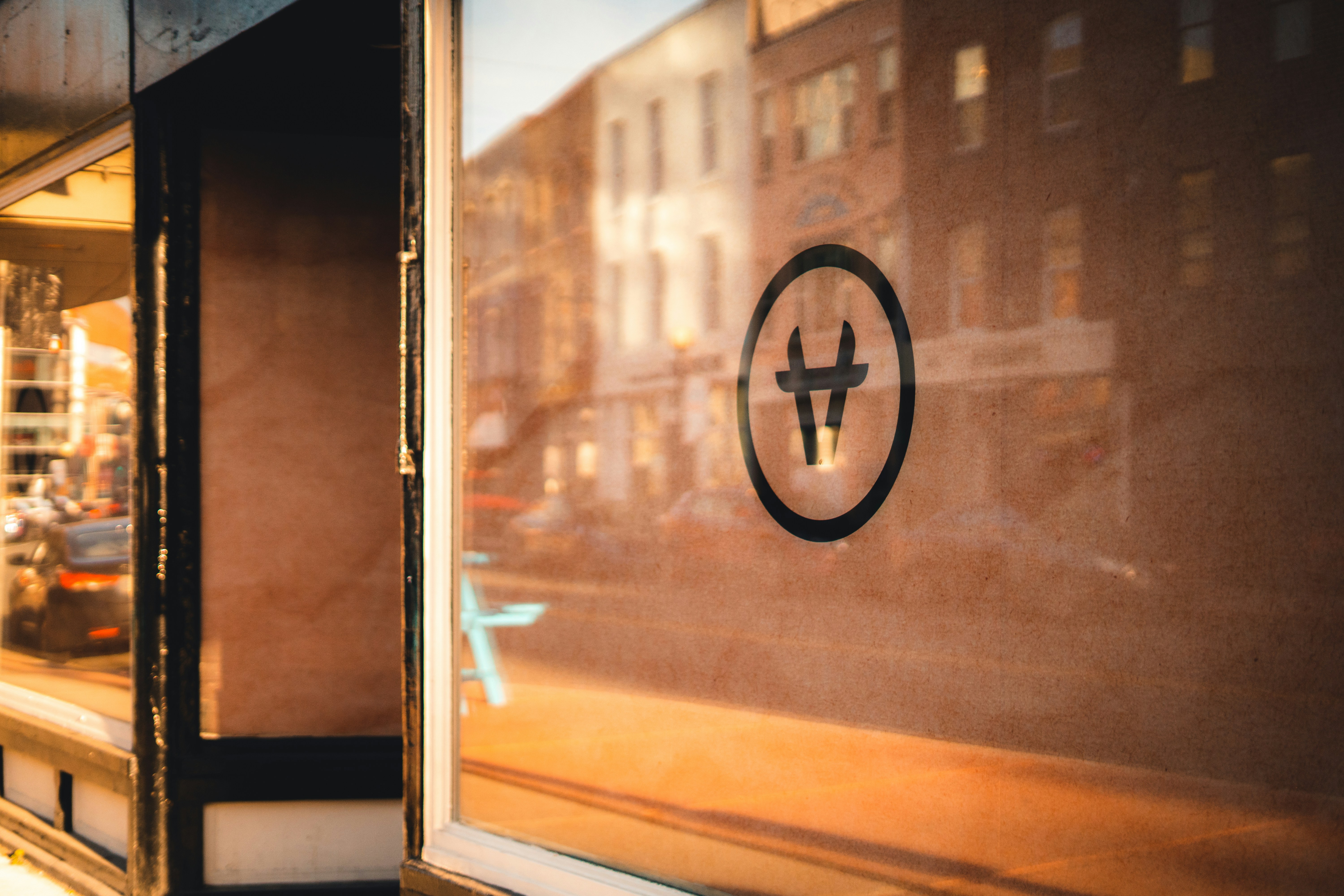 Amber Window: Quiet Street Reflections in a Cashless Shop
