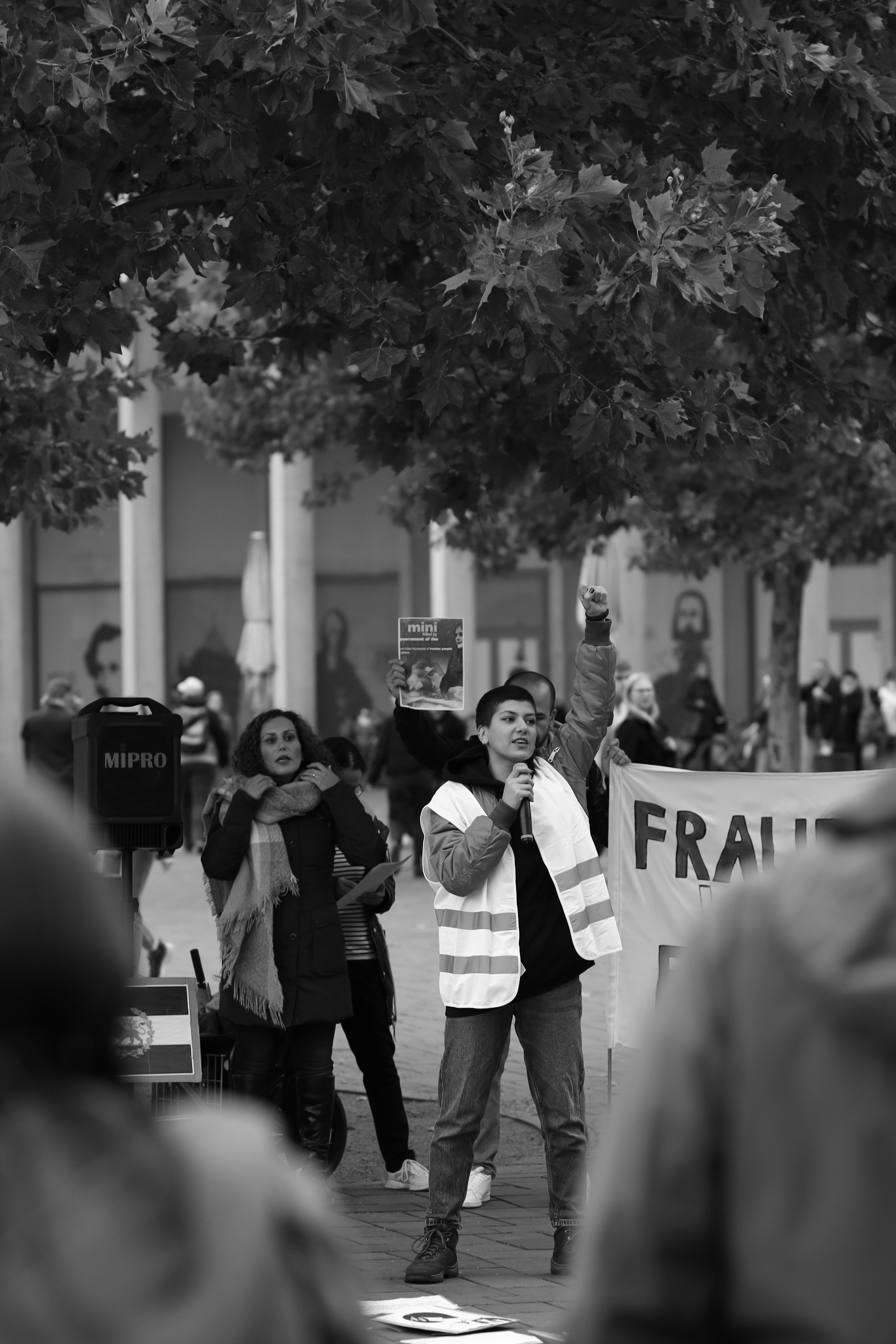 Silent Voice, Bright Jacket: A Protester Leads with a Raised Fist