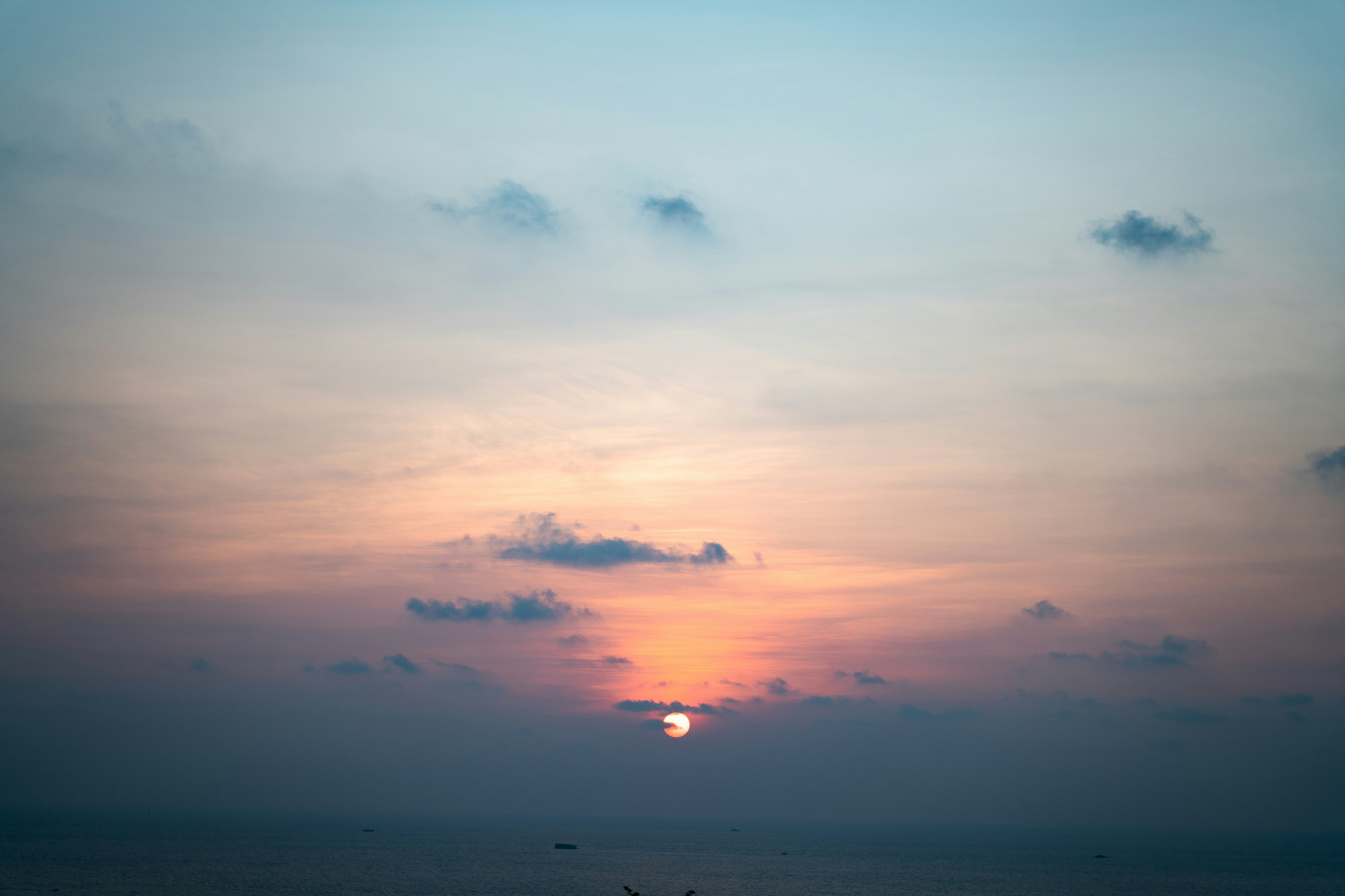 Last Light on a Quiet Sea: A Velvet Sunset Over Calm Waters
