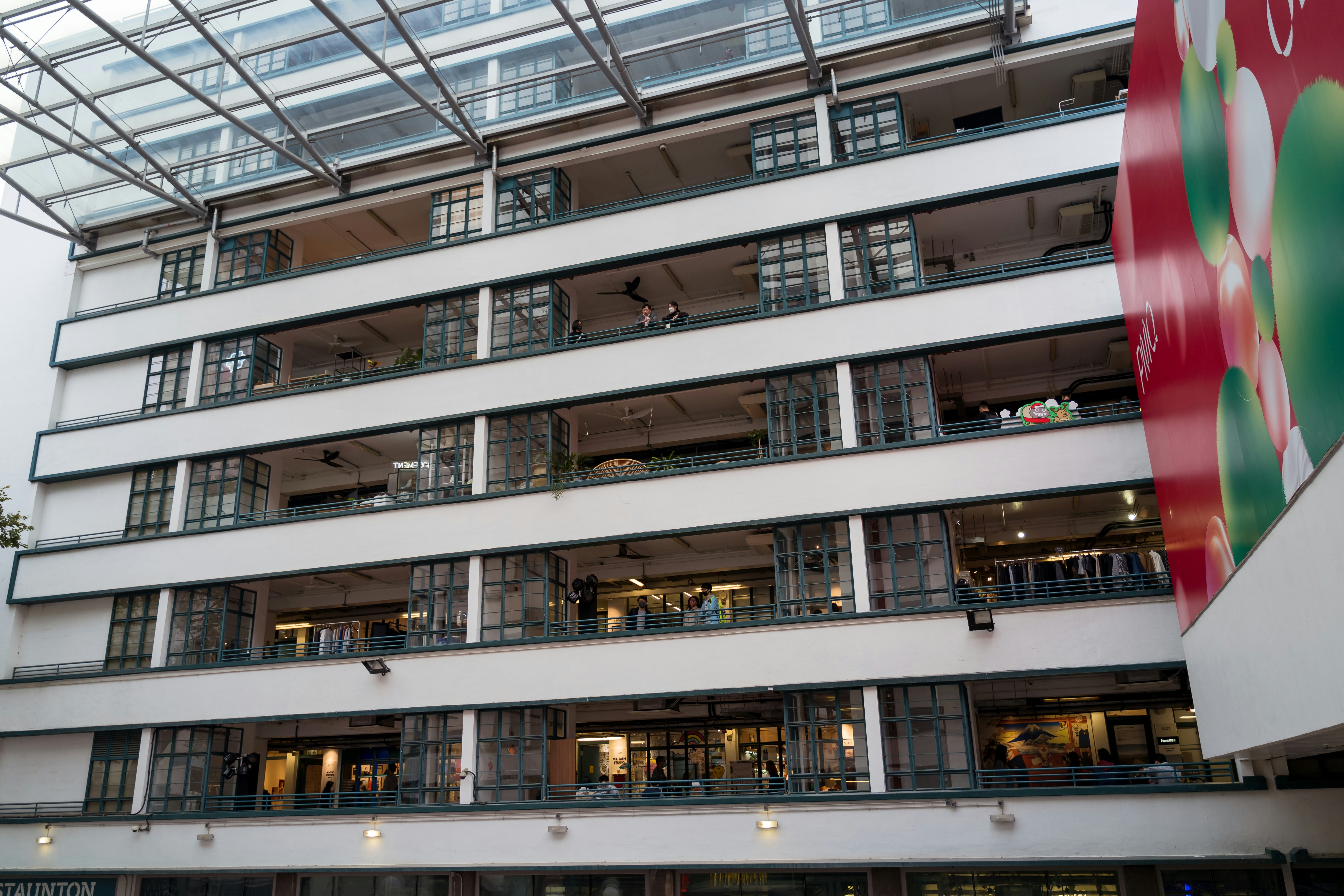 A building with a flag in front photo – Free Building Image on Unsplash