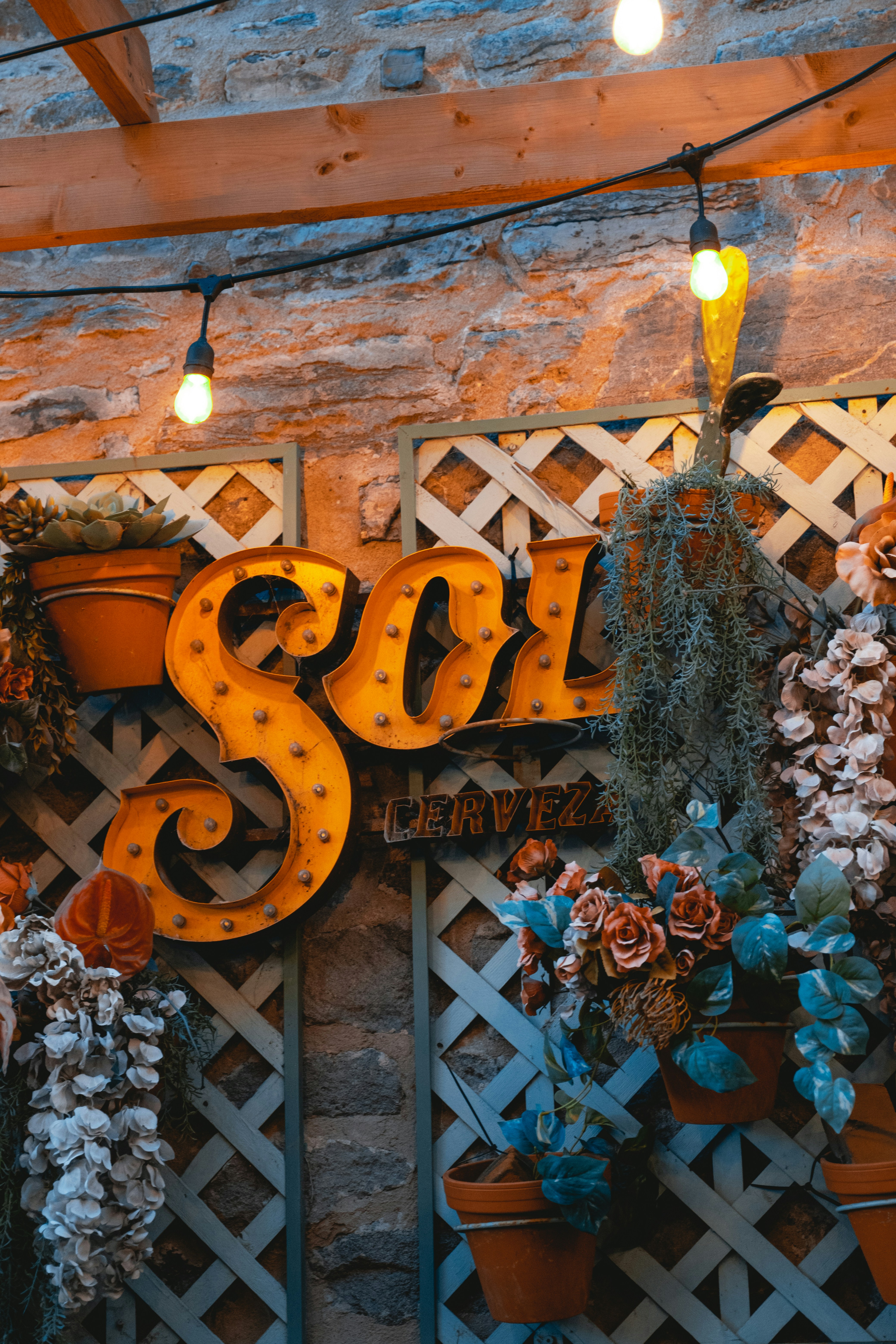 Amber Signage in a Rustic Floral Courtyard