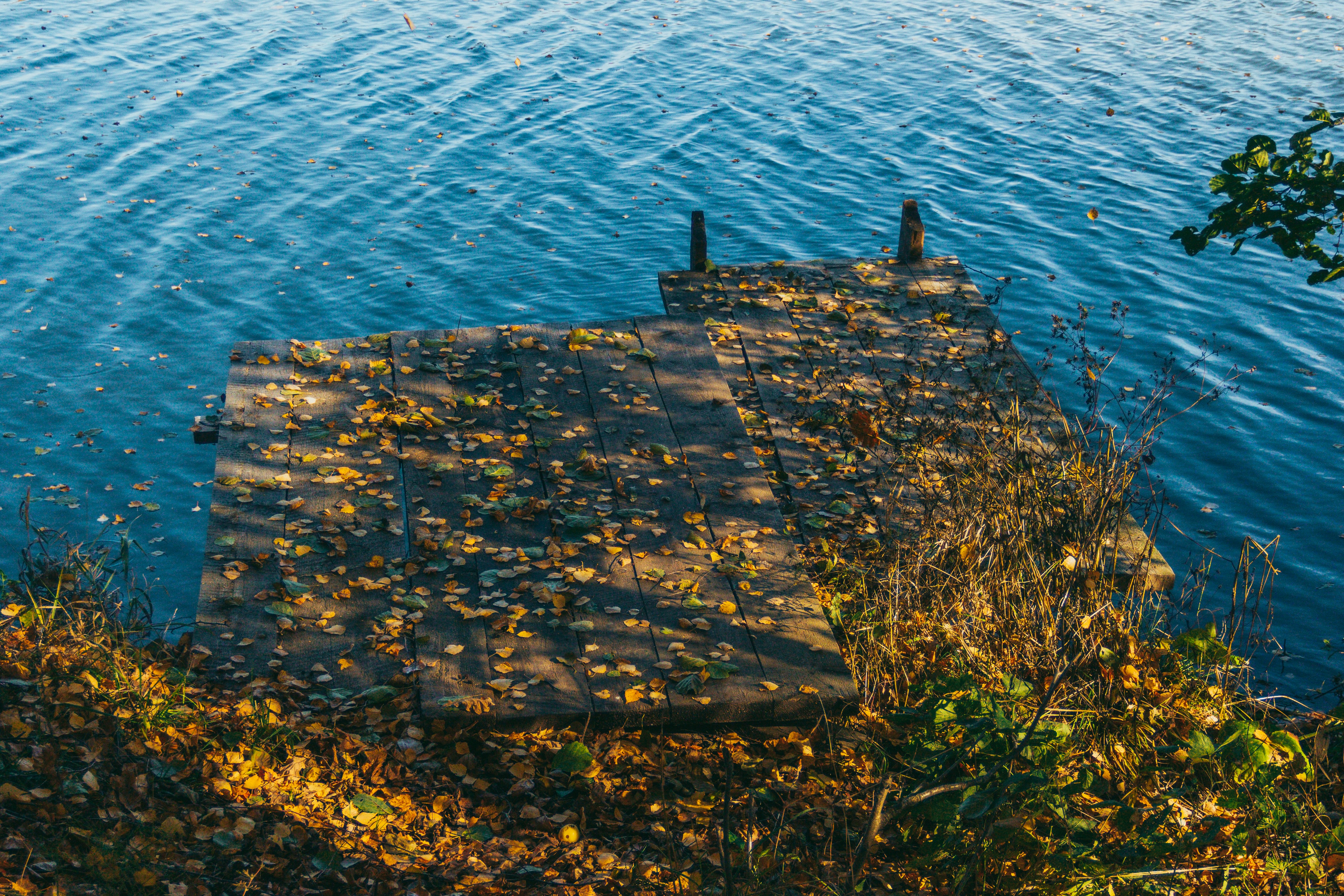 A stone walkway over water photo – Free Warm Image on Unsplash