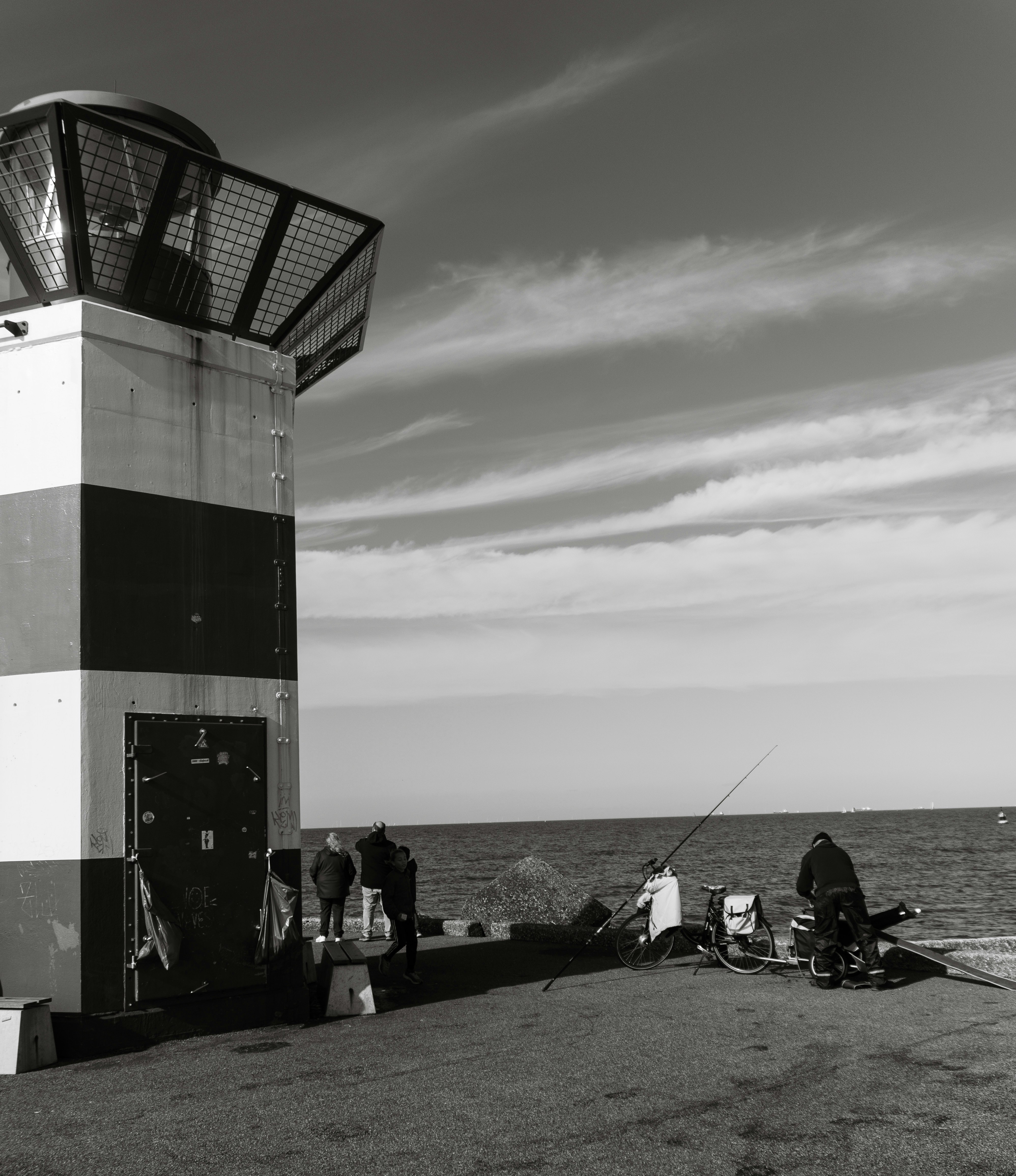 Coastline Watch: Lifeguard Tower and Quiet Fishermen