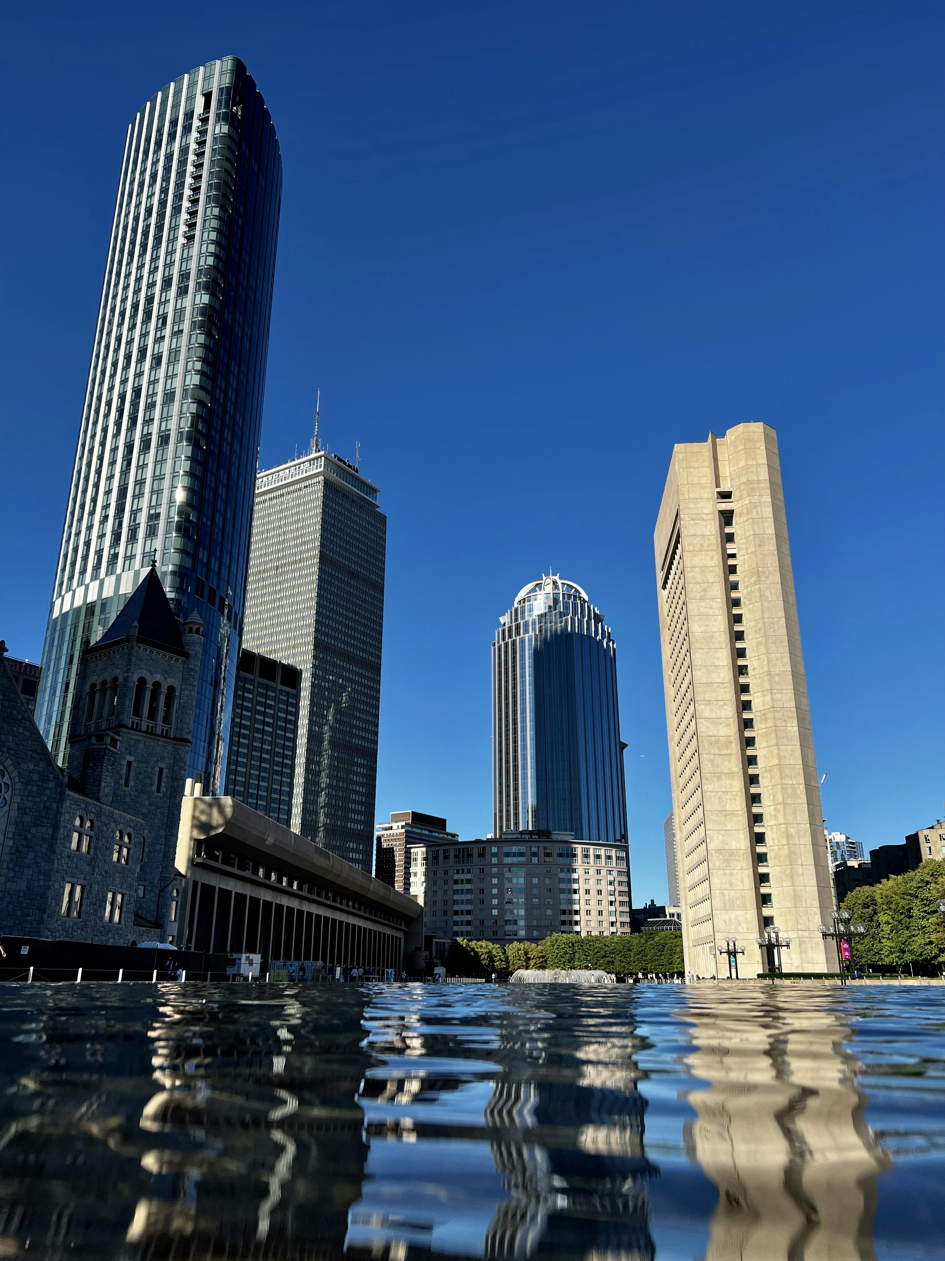 Glass Giants Reflecting on a Quiet River