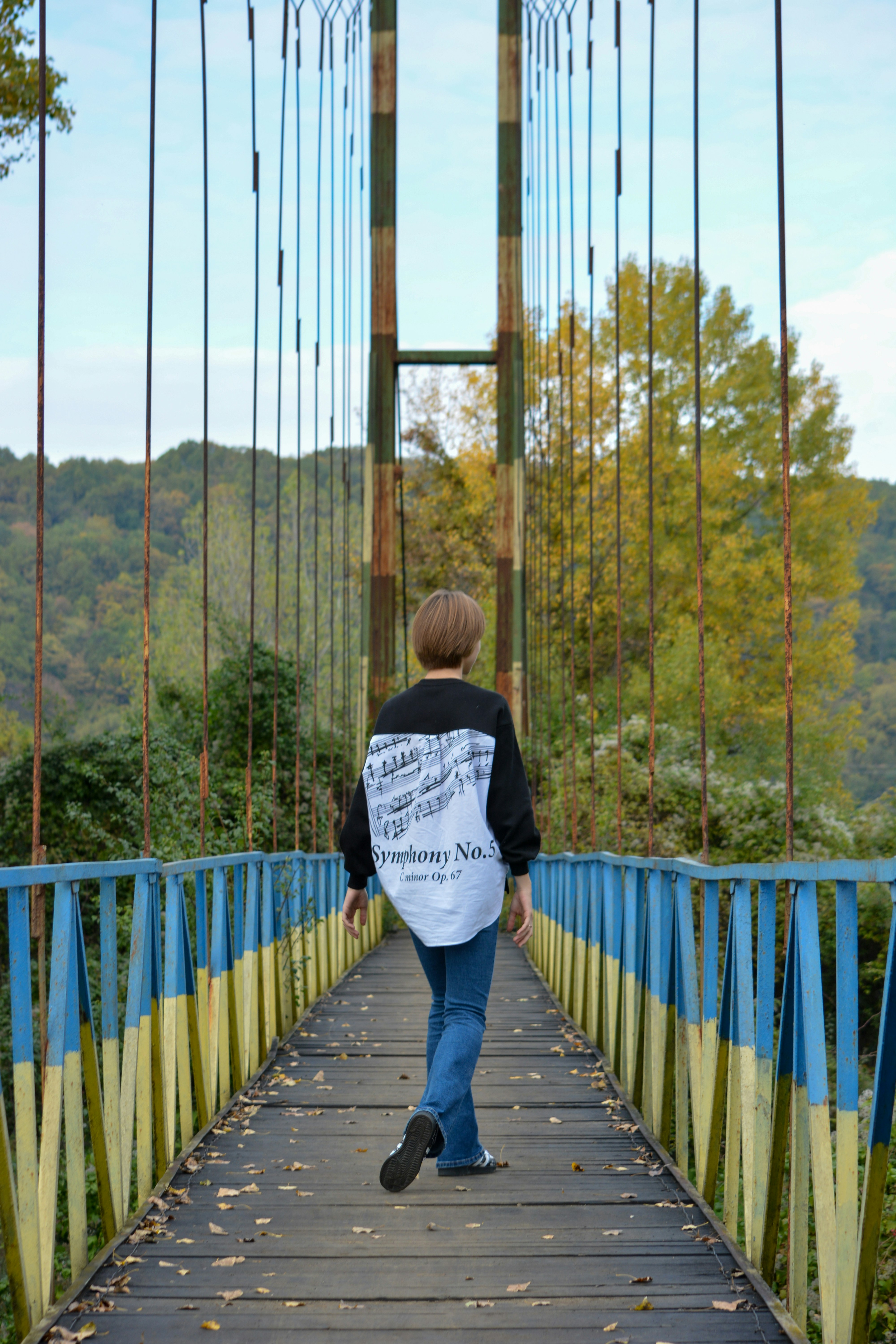 a man walking on a bridge