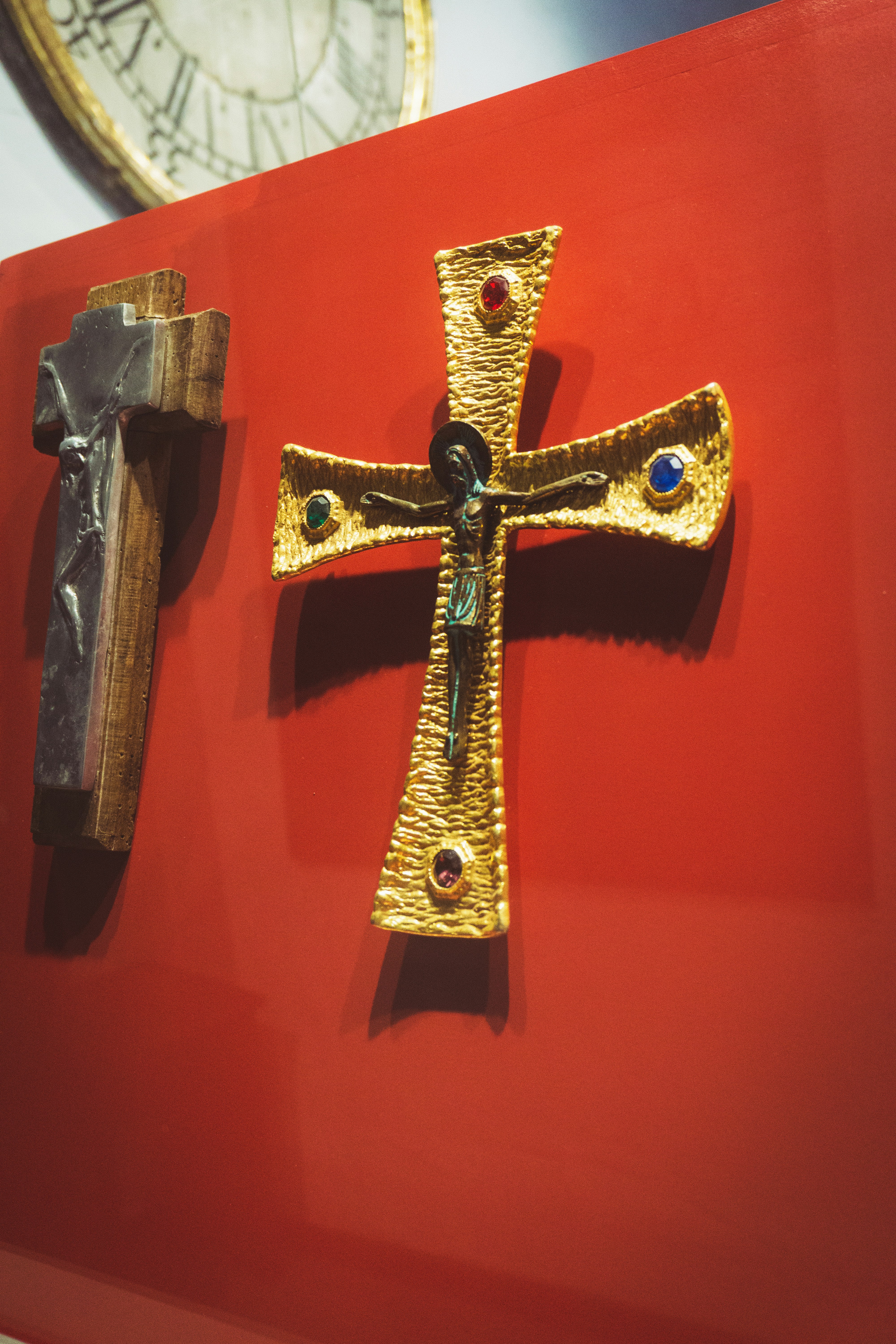 a cross on a red surface