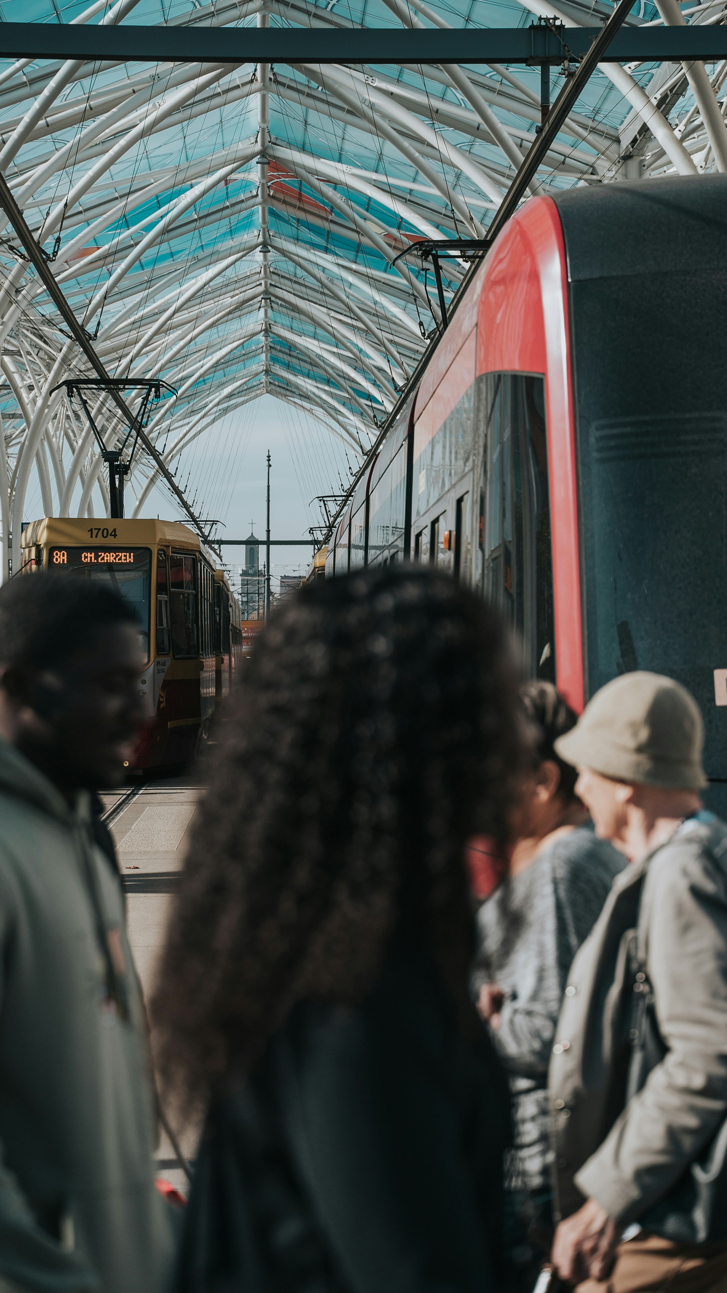 Canopy Cathedral: The Red Carriage Framed by Glass-Steel Arches