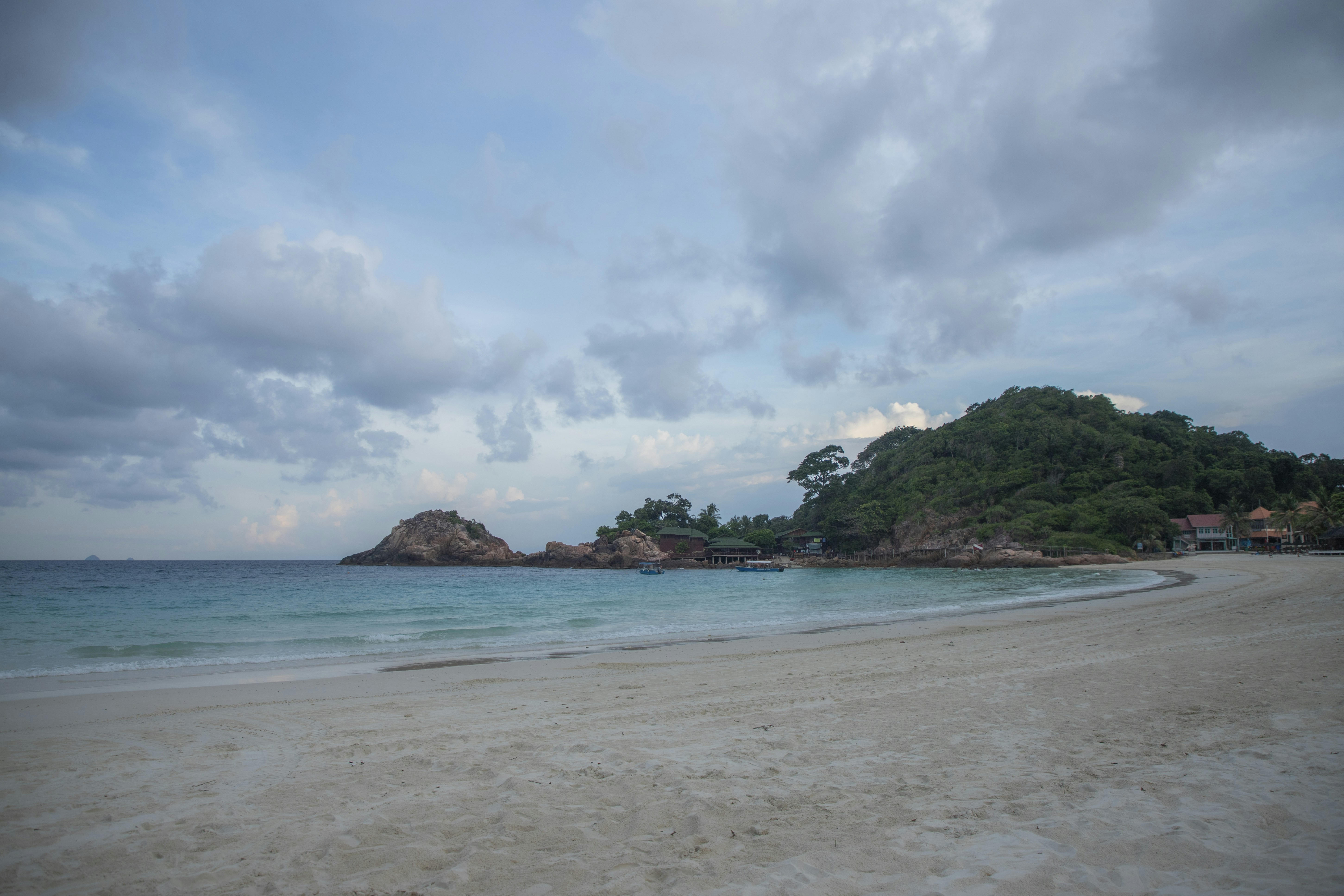 Rocky Outcrop at a Quiet Cove Under a Clouded Sky
