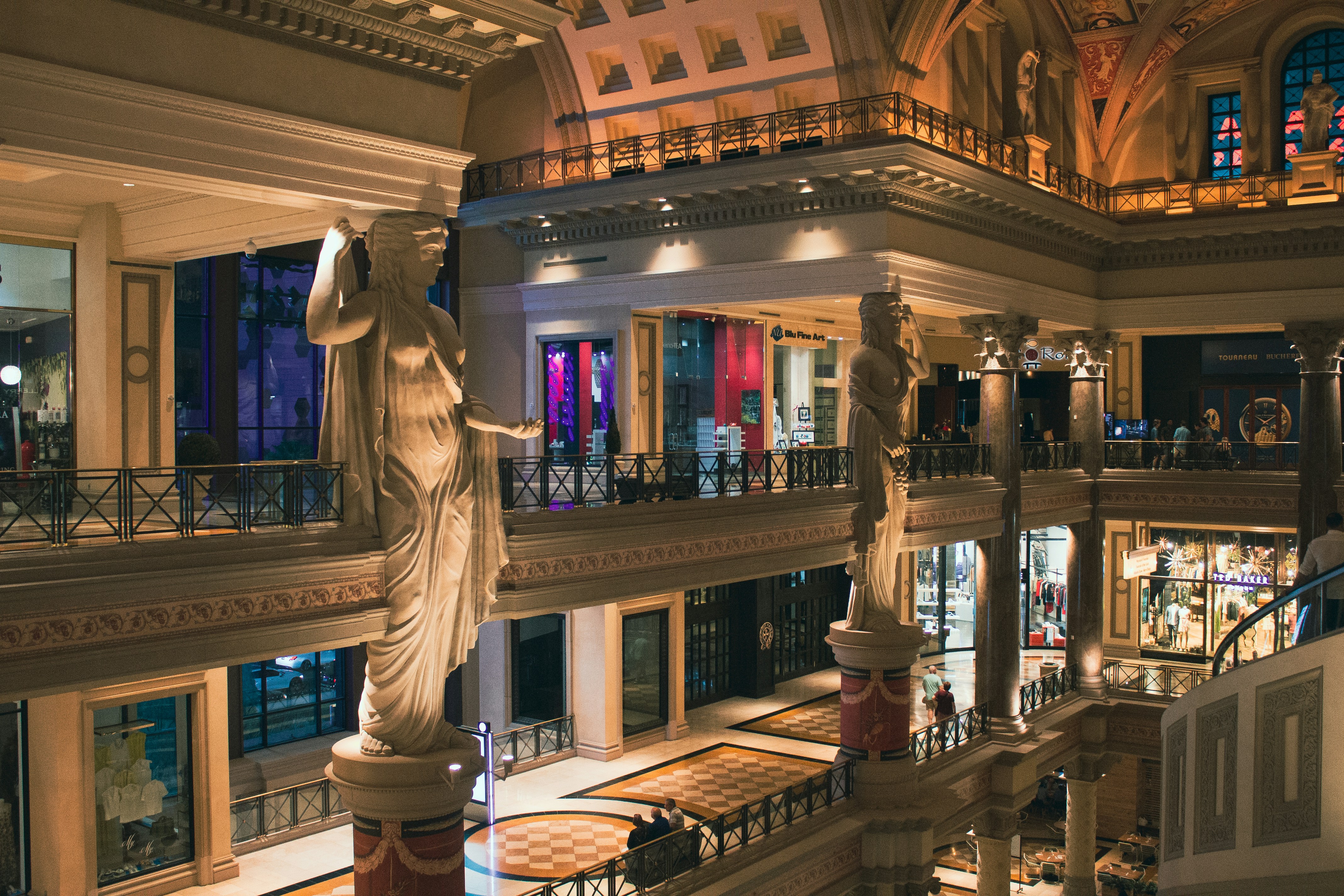 A large ornate building with statues photo – Free Caesars palace Image ...