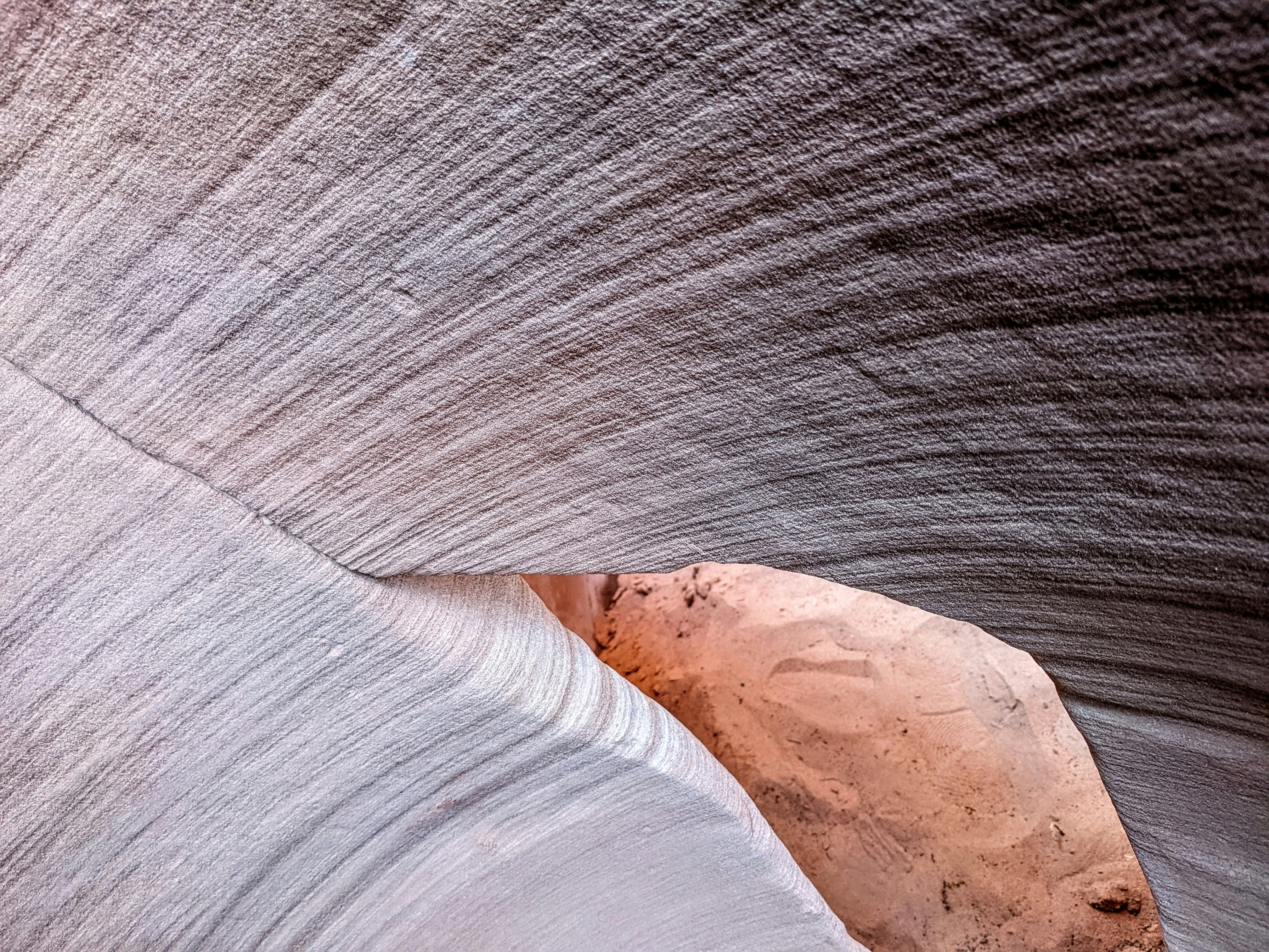 Curved Desert Grains: A Sunlit Arch in Moonlight Sand