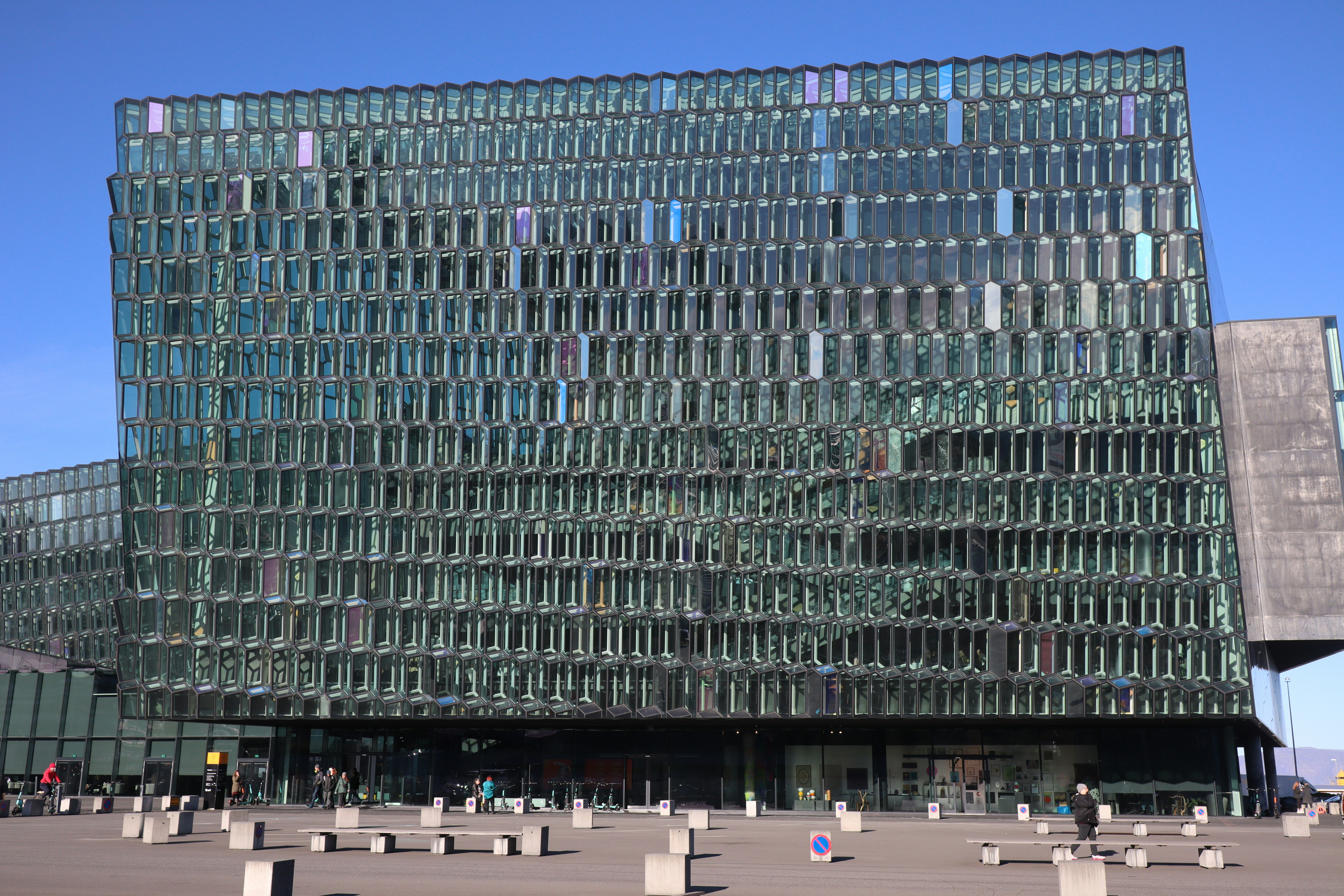 A building with many windows photo – Free Harpa concert hall and ...