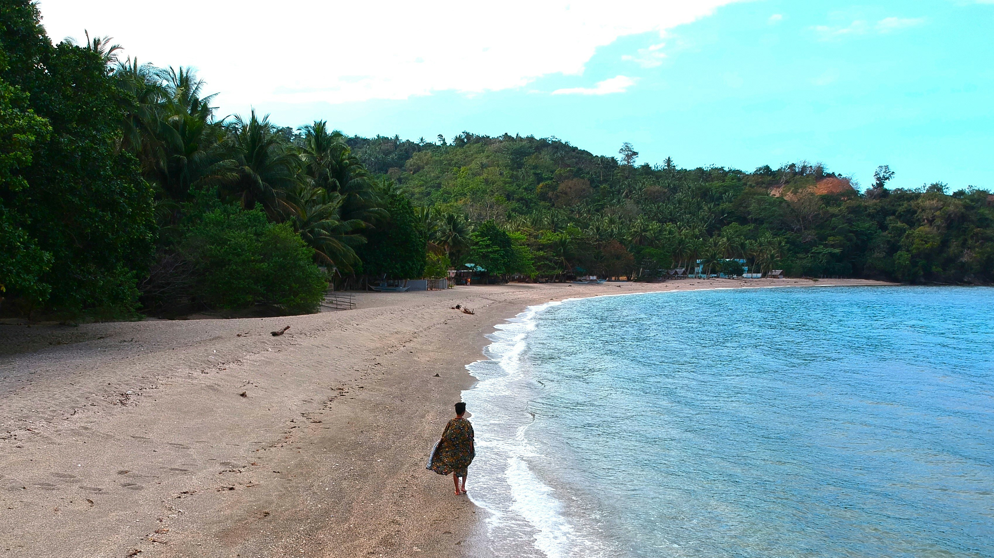 a person walking on a beach