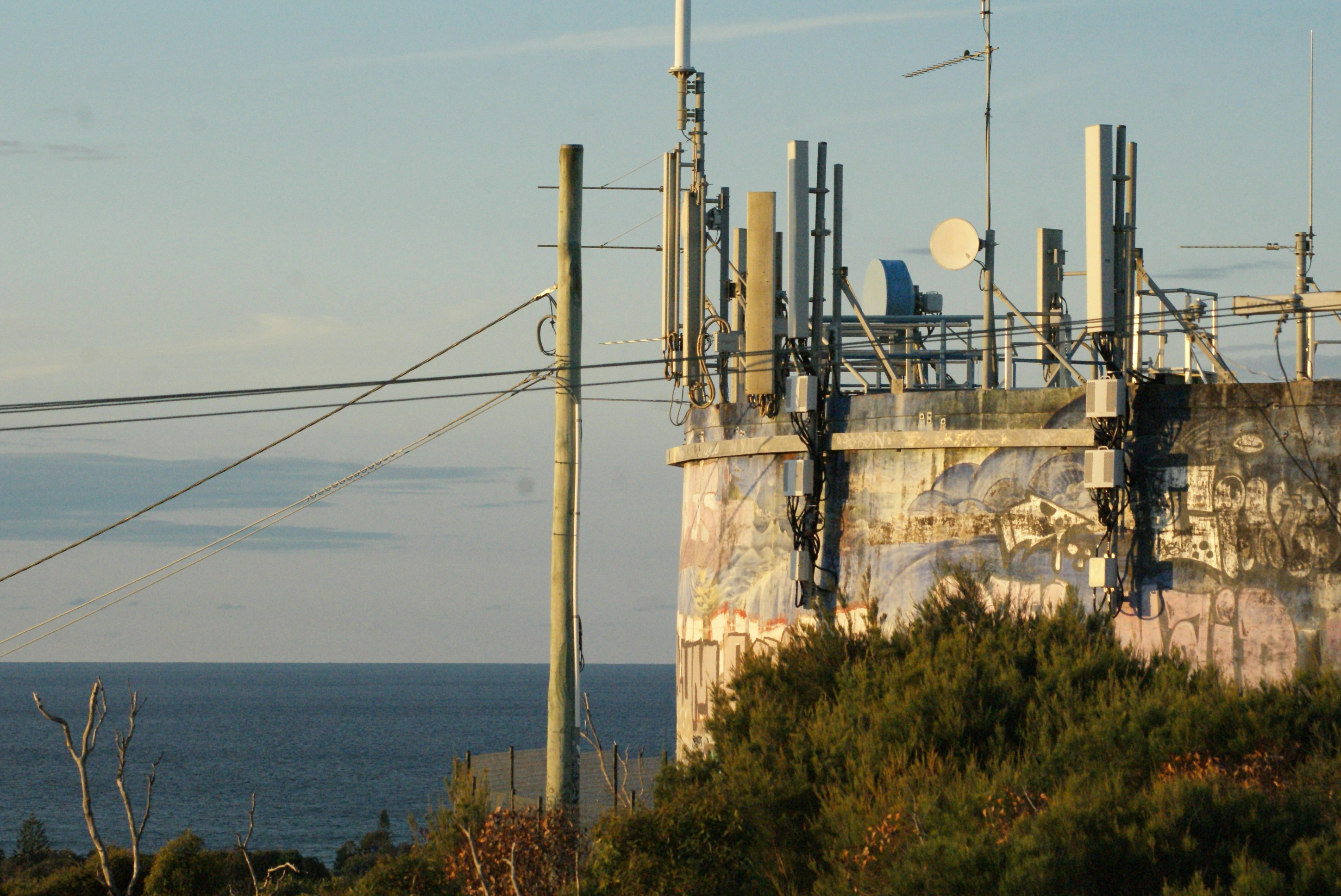 Coastal Station: Weathered Tower with Ocean Backdrop