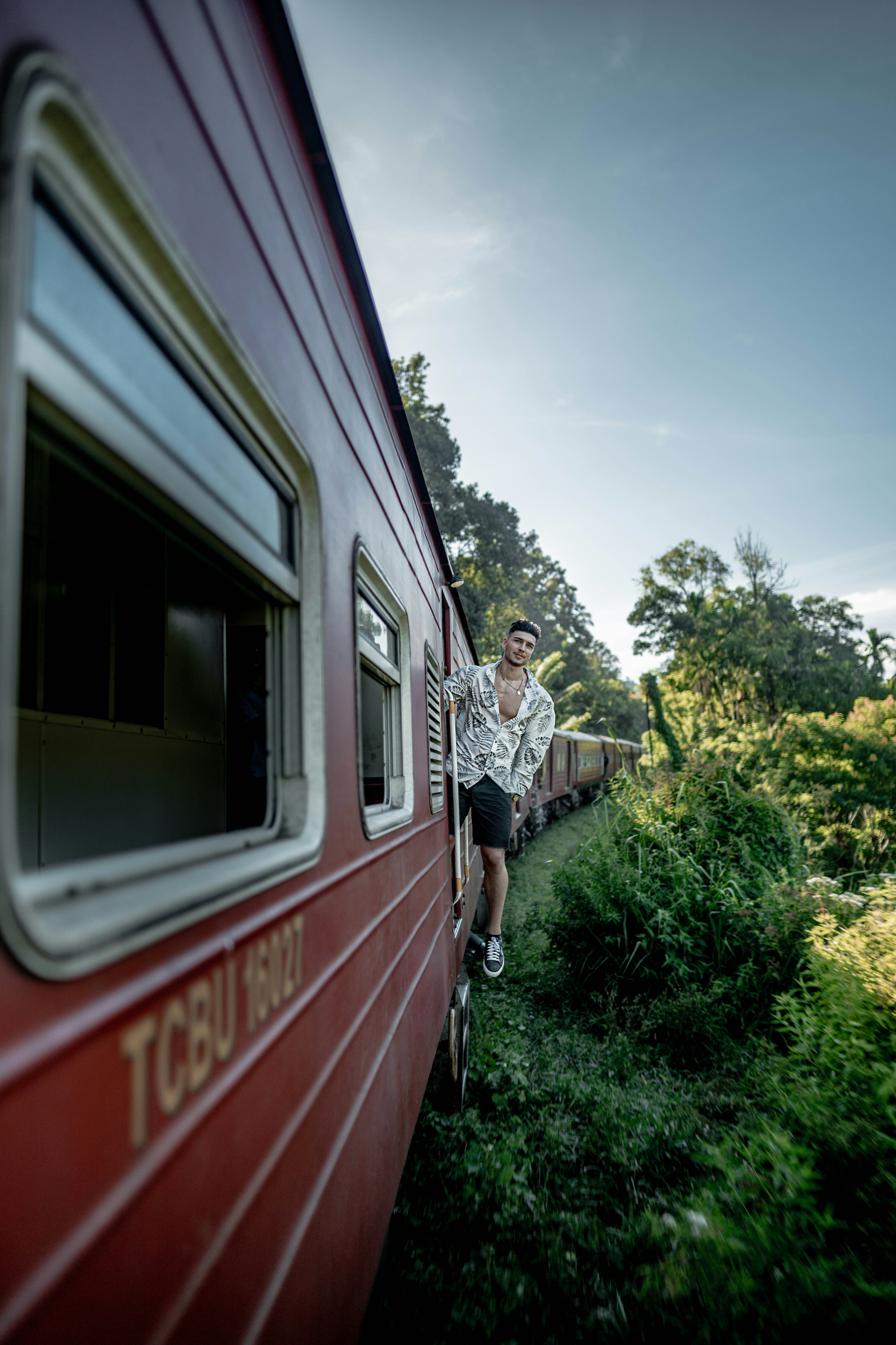 A person standing on a train photo – Free Transportation Image on Unsplash