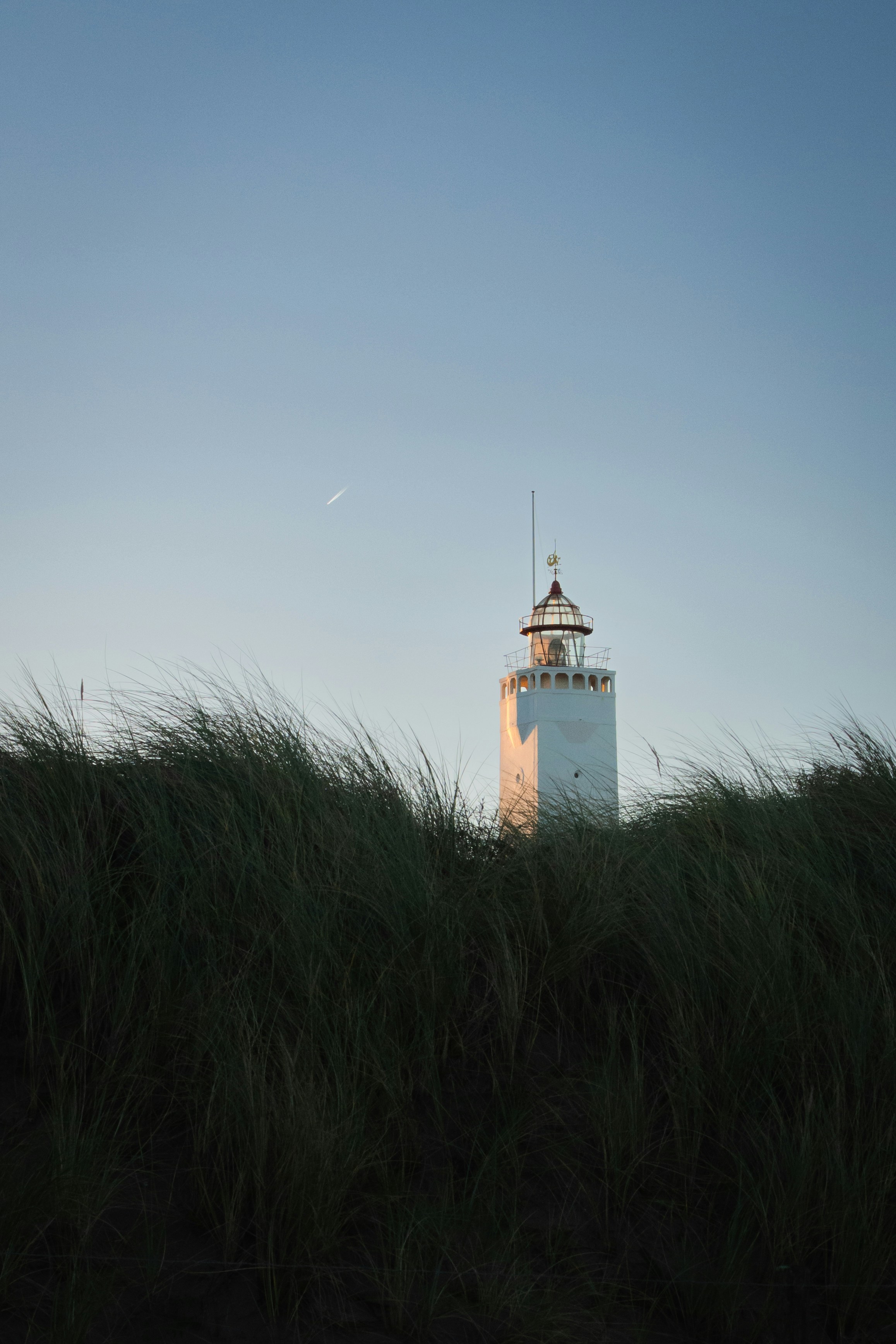A lighthouse in the middle of a field photo – Free Noordwijk Image on ...
