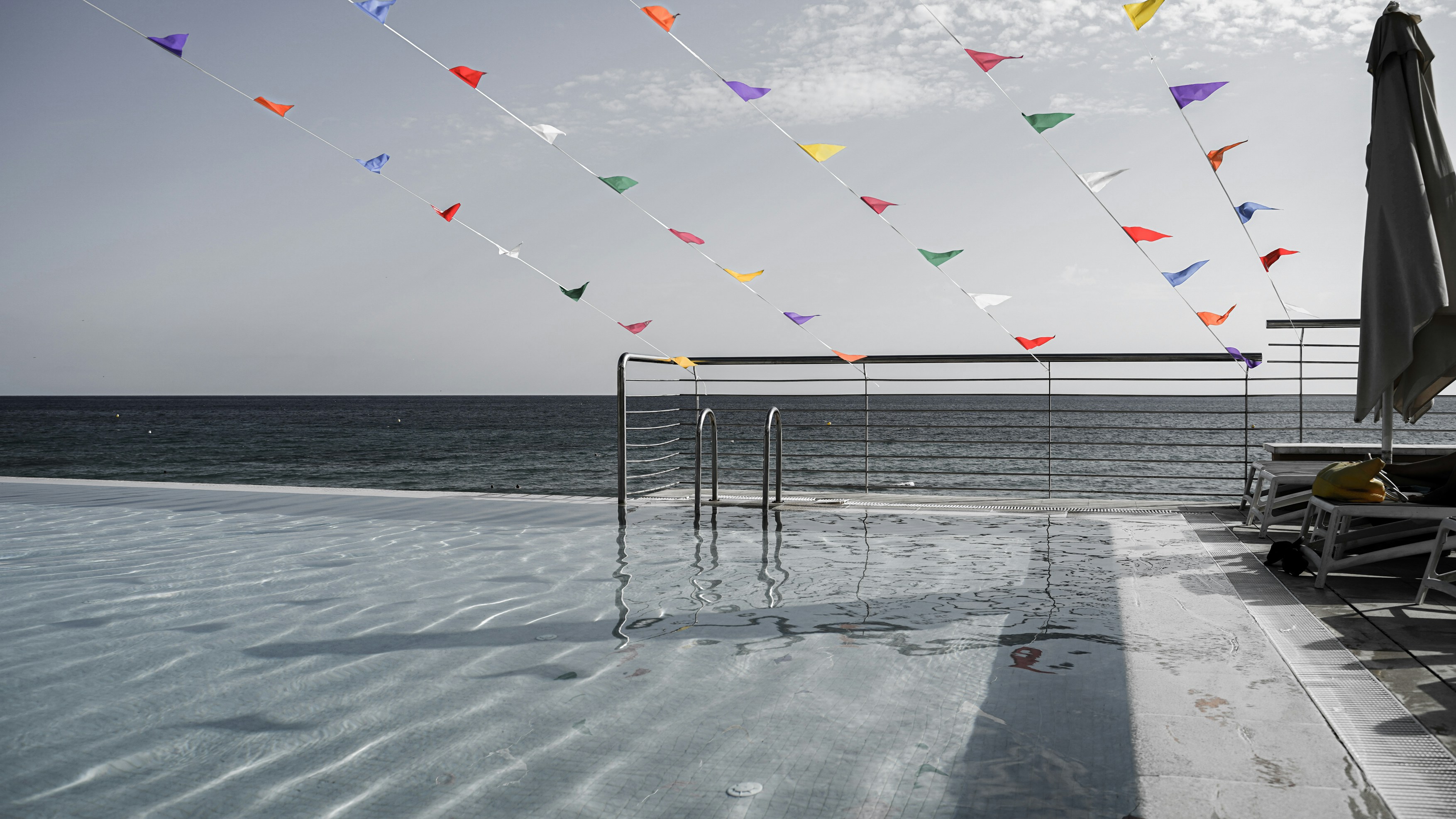 Flags Over the Pool: Poolside Calm Under a Rainbow of Pennants