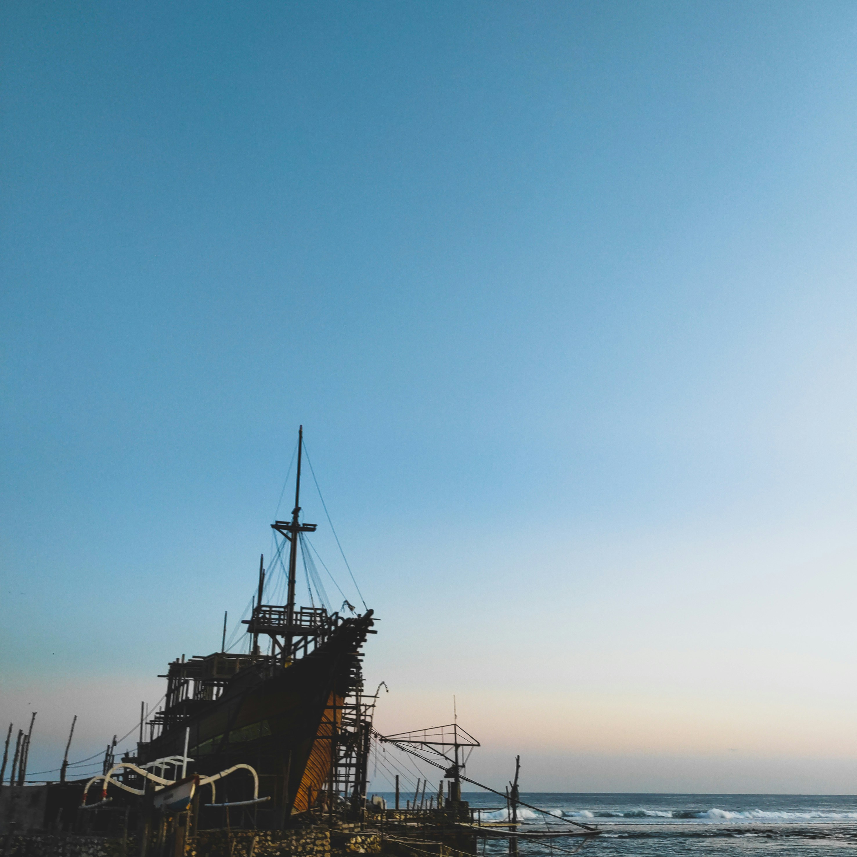 View of the unfinished construction of the fisherman's ship. Located near the night club in the main area of the beach resort.