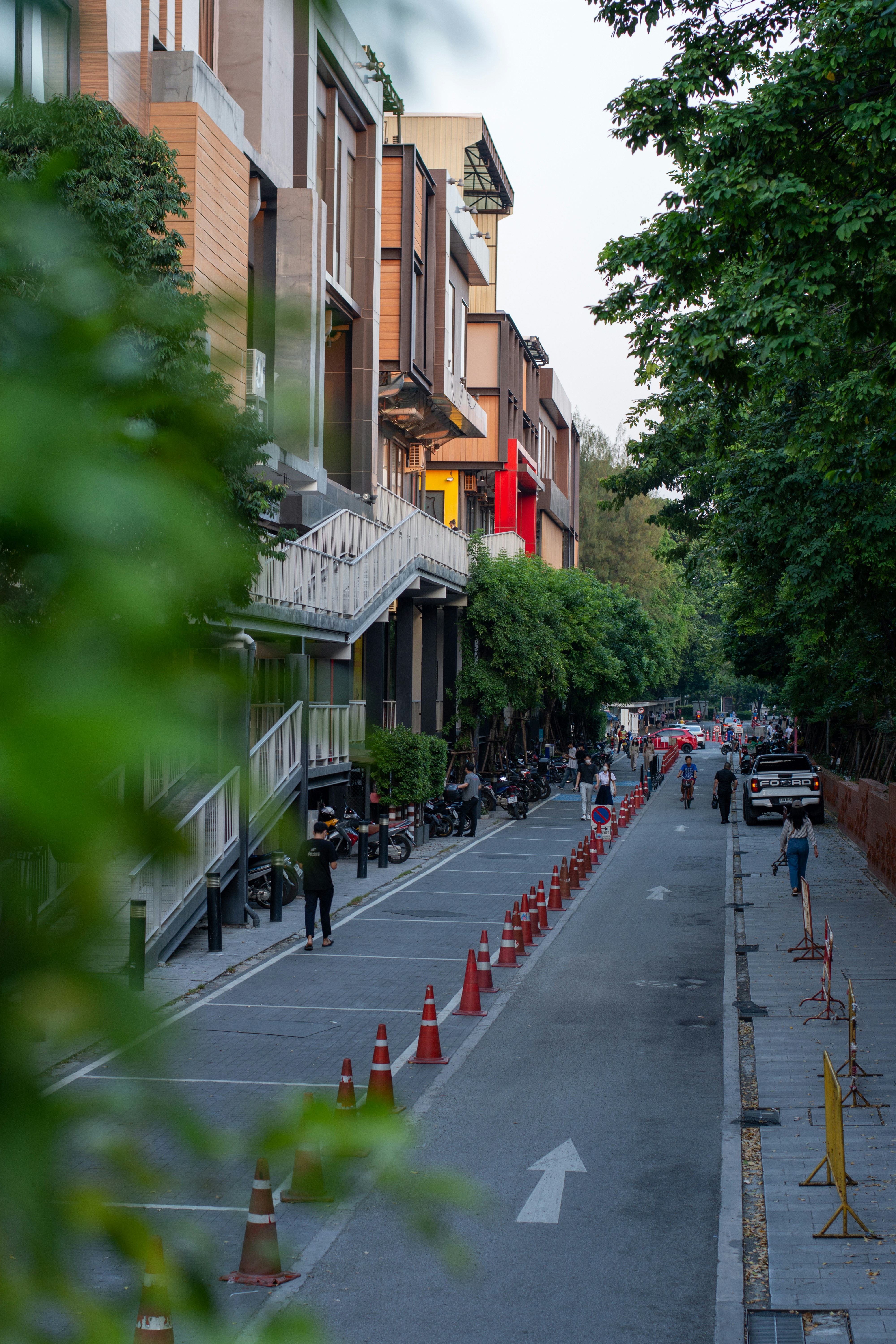 Orange Balconies, Orange Cones: A City Street in Transition