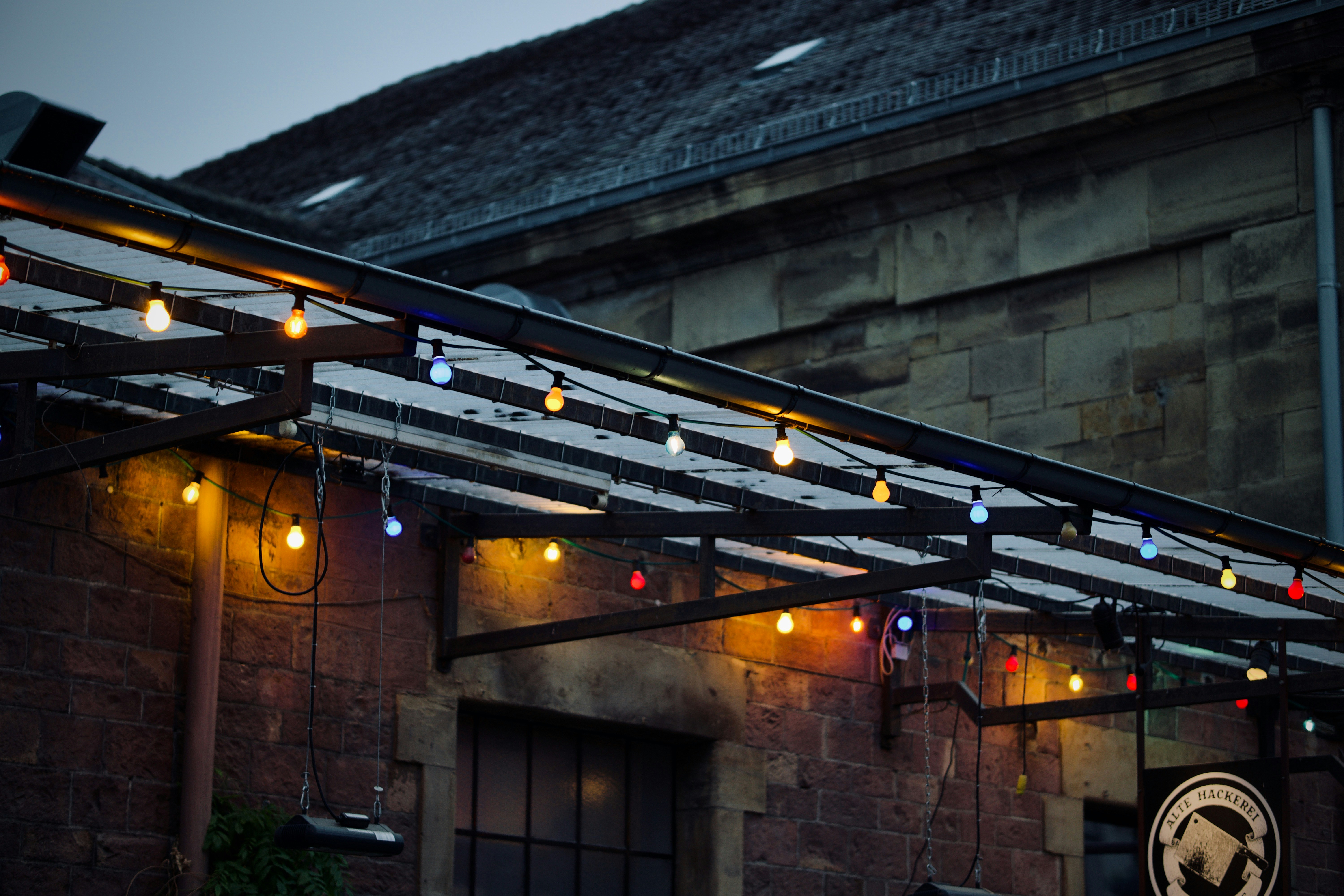 A building with lights on the roof photo – Free Lamp Image on Unsplash