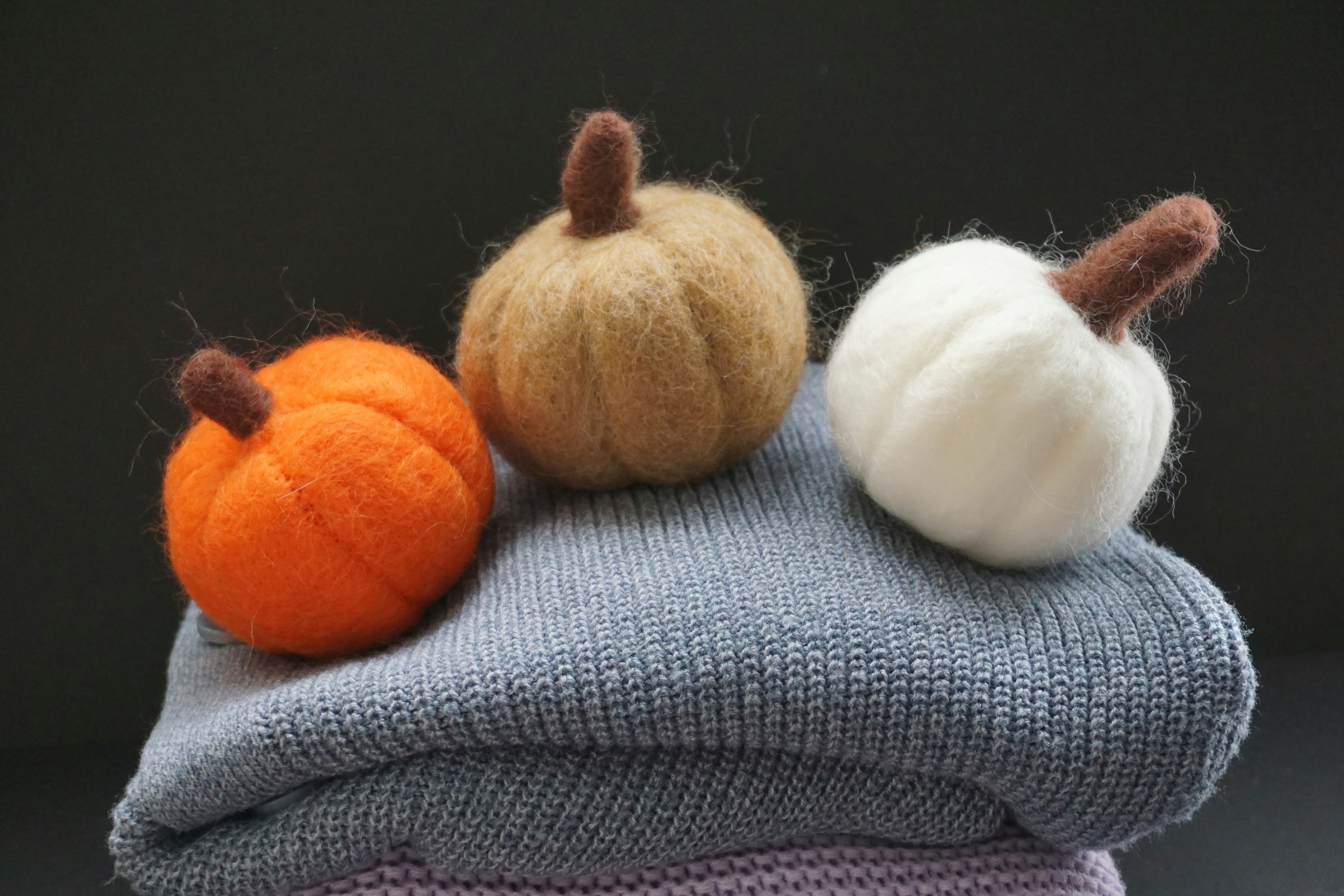 Centerpiece of Felted Gourds on a Folded Knit Stack