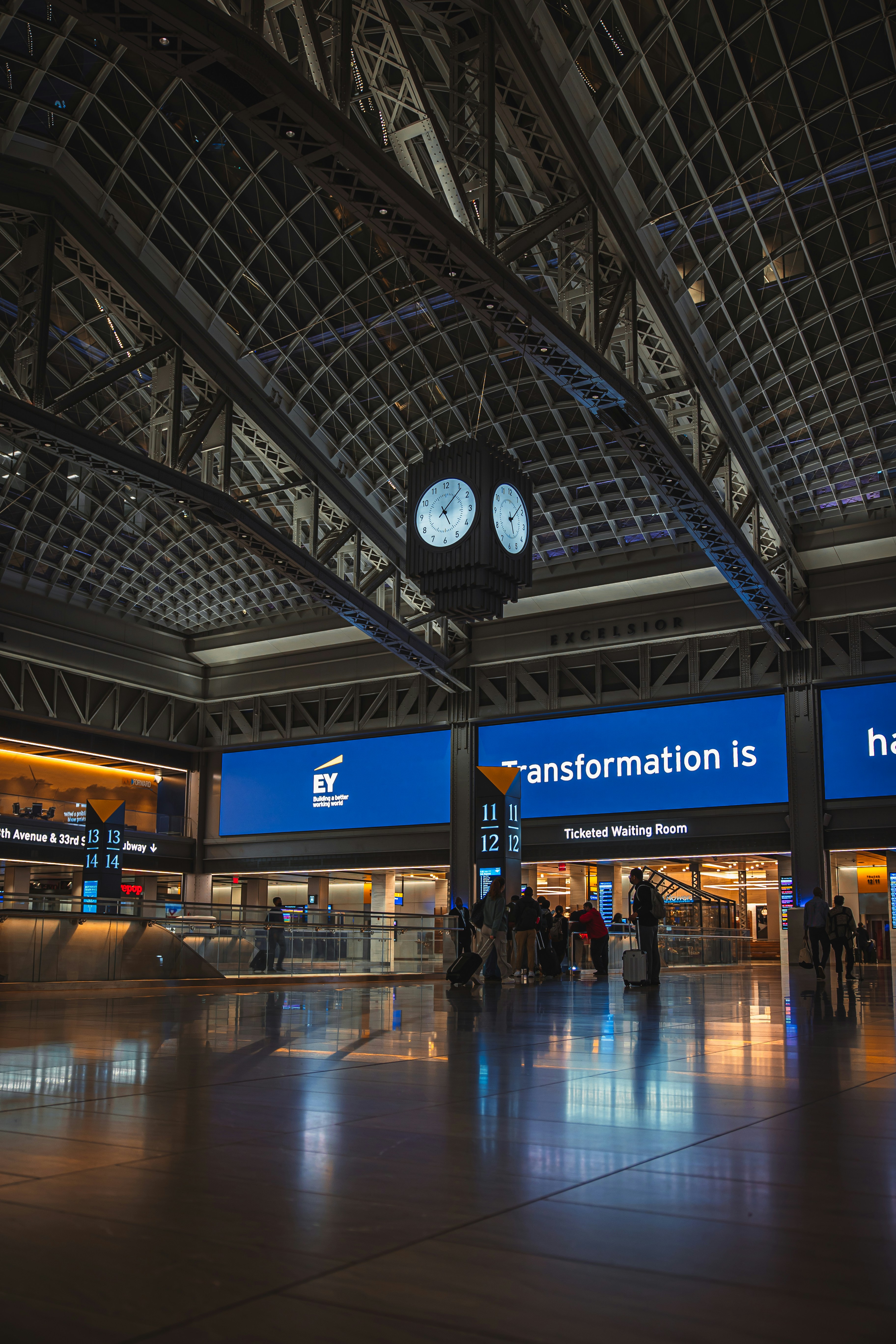 A large clock hangs from the ceiling photo – Free New york Image on ...