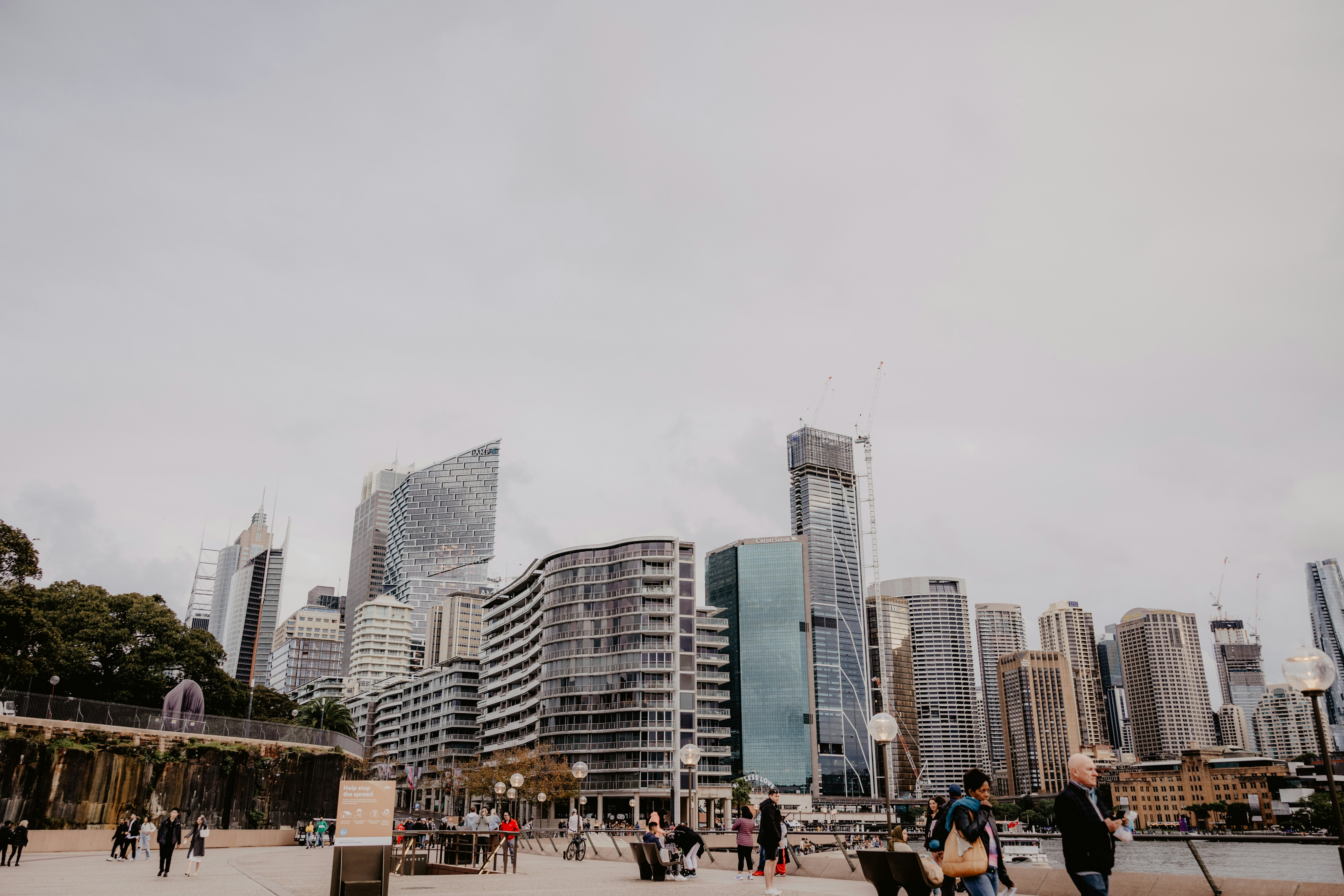 Urban Panorama: Skyscrapers Rise Over a Lively Harborfront