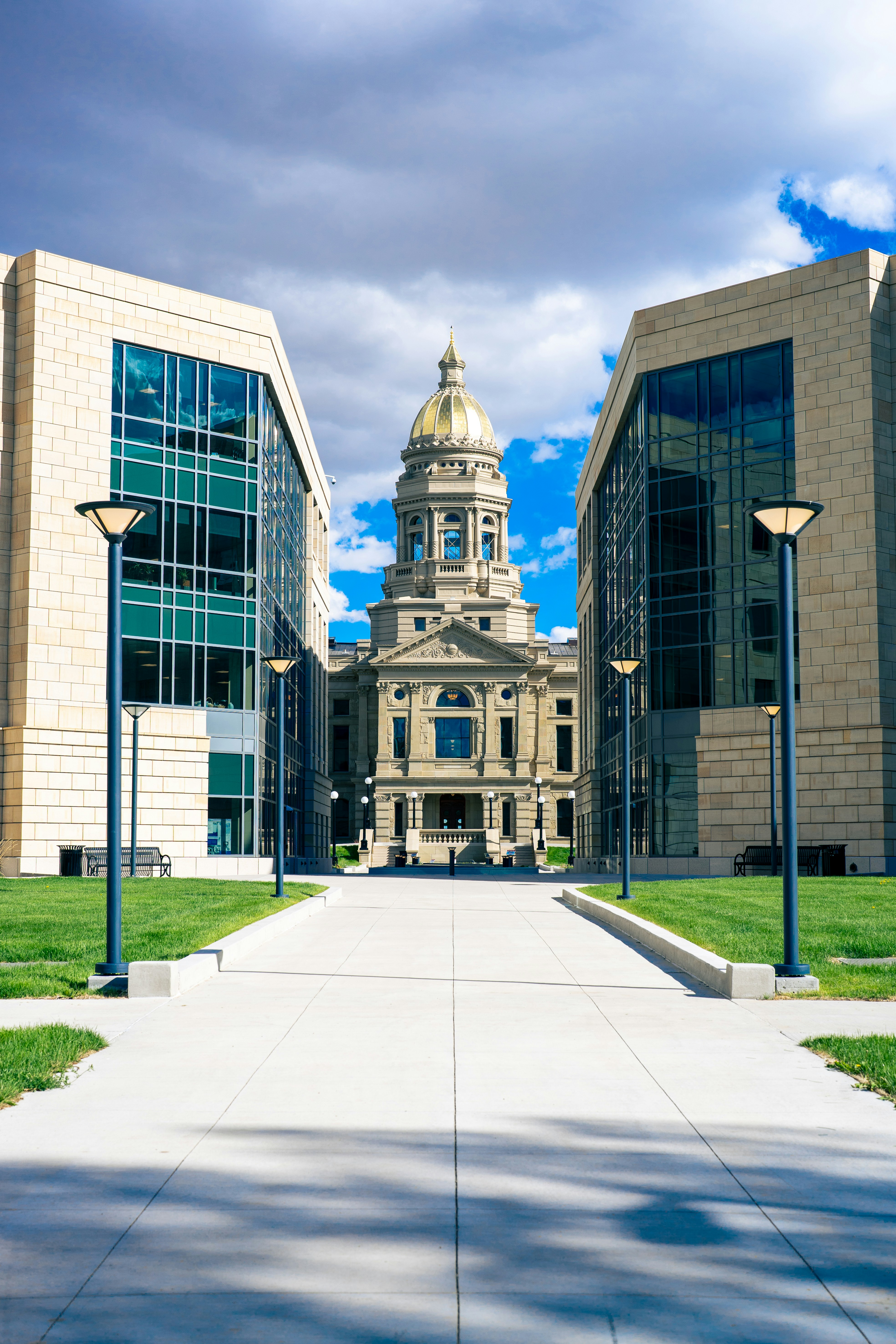 A walkway between buildings photo – Free Capital building Image on Unsplash