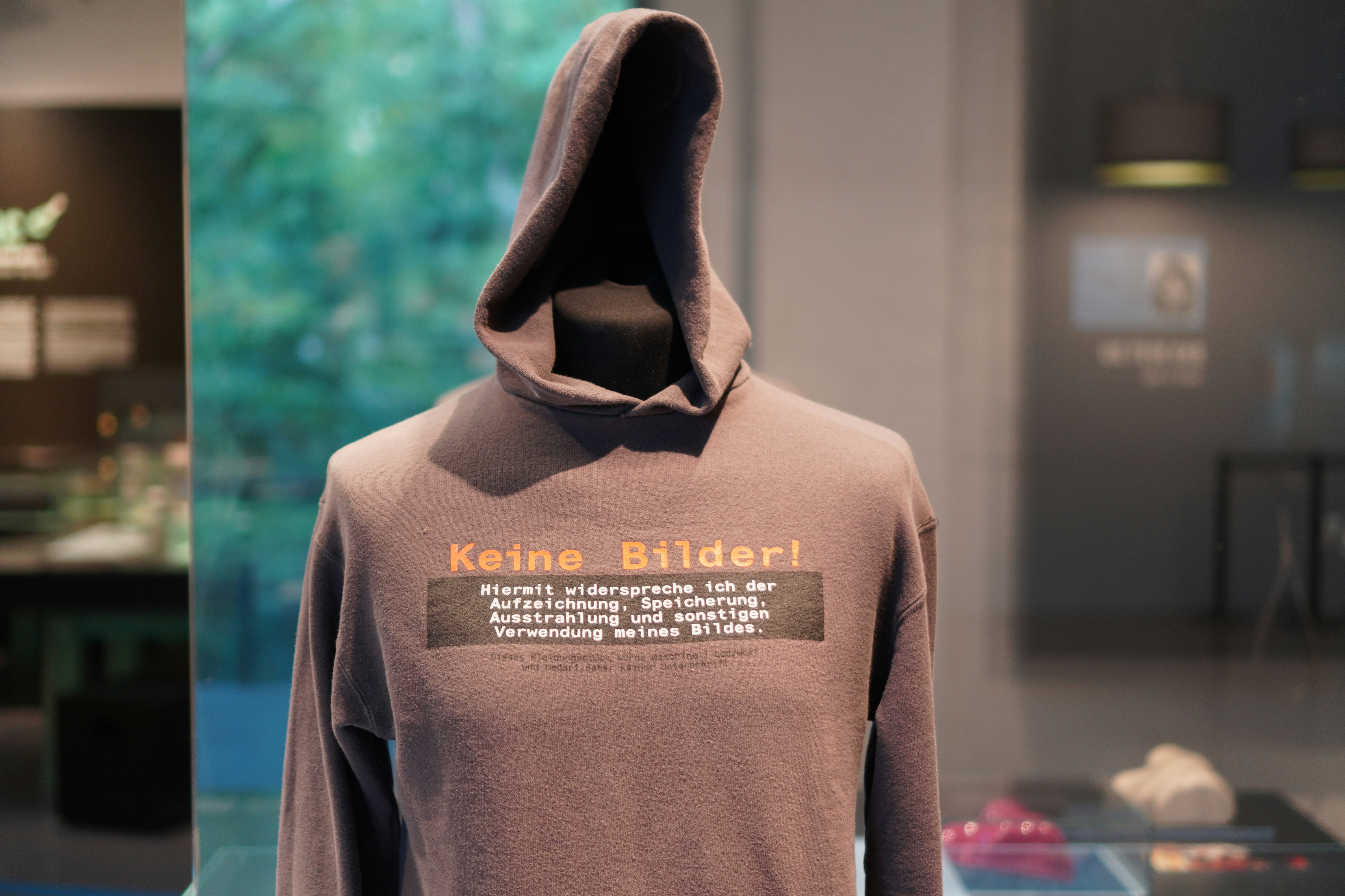 Hooded Display: The Message on a Quiet Gallery Hoodie