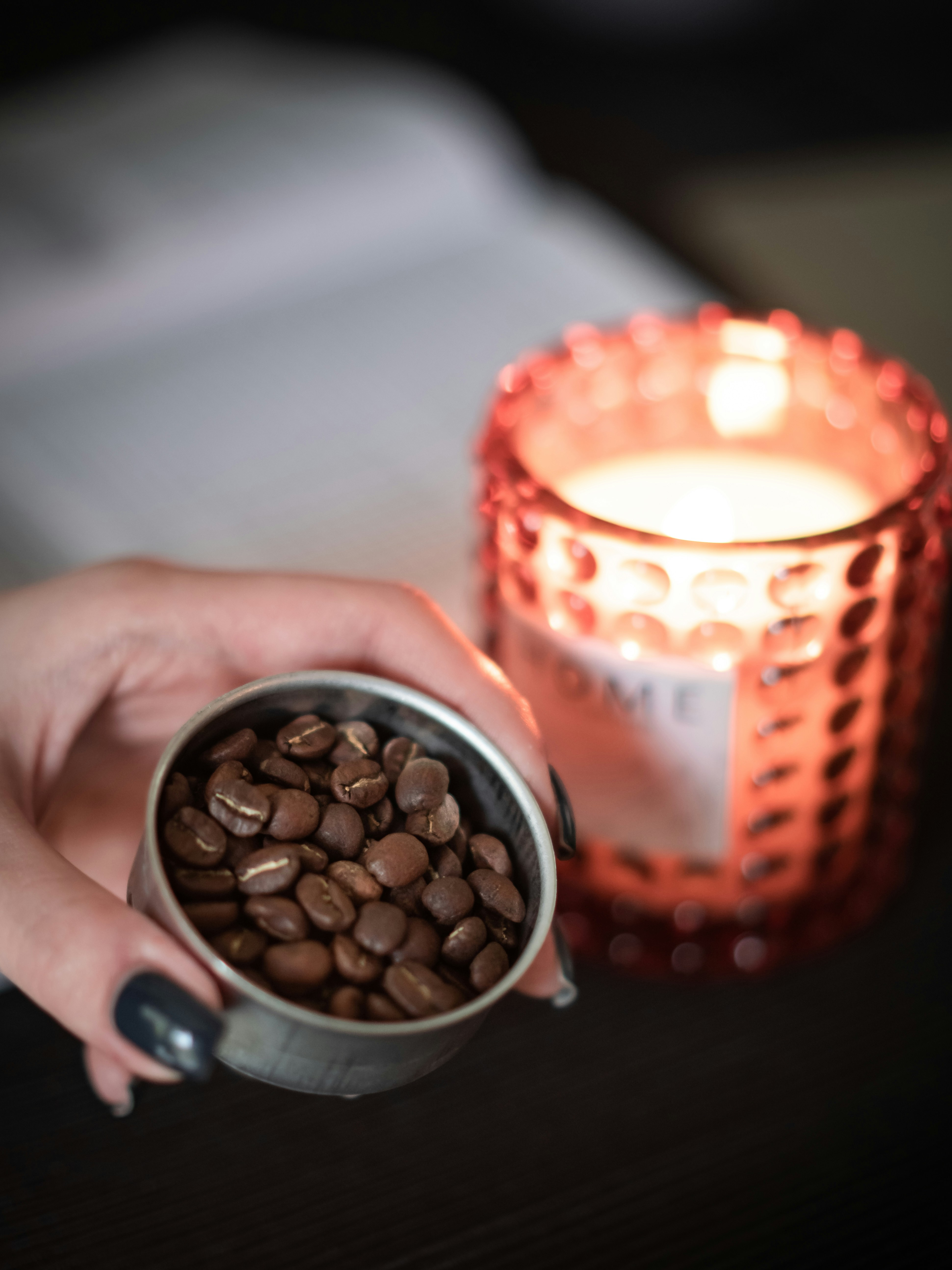 Copper Tin of Roasted Beans Framed by Candlelight