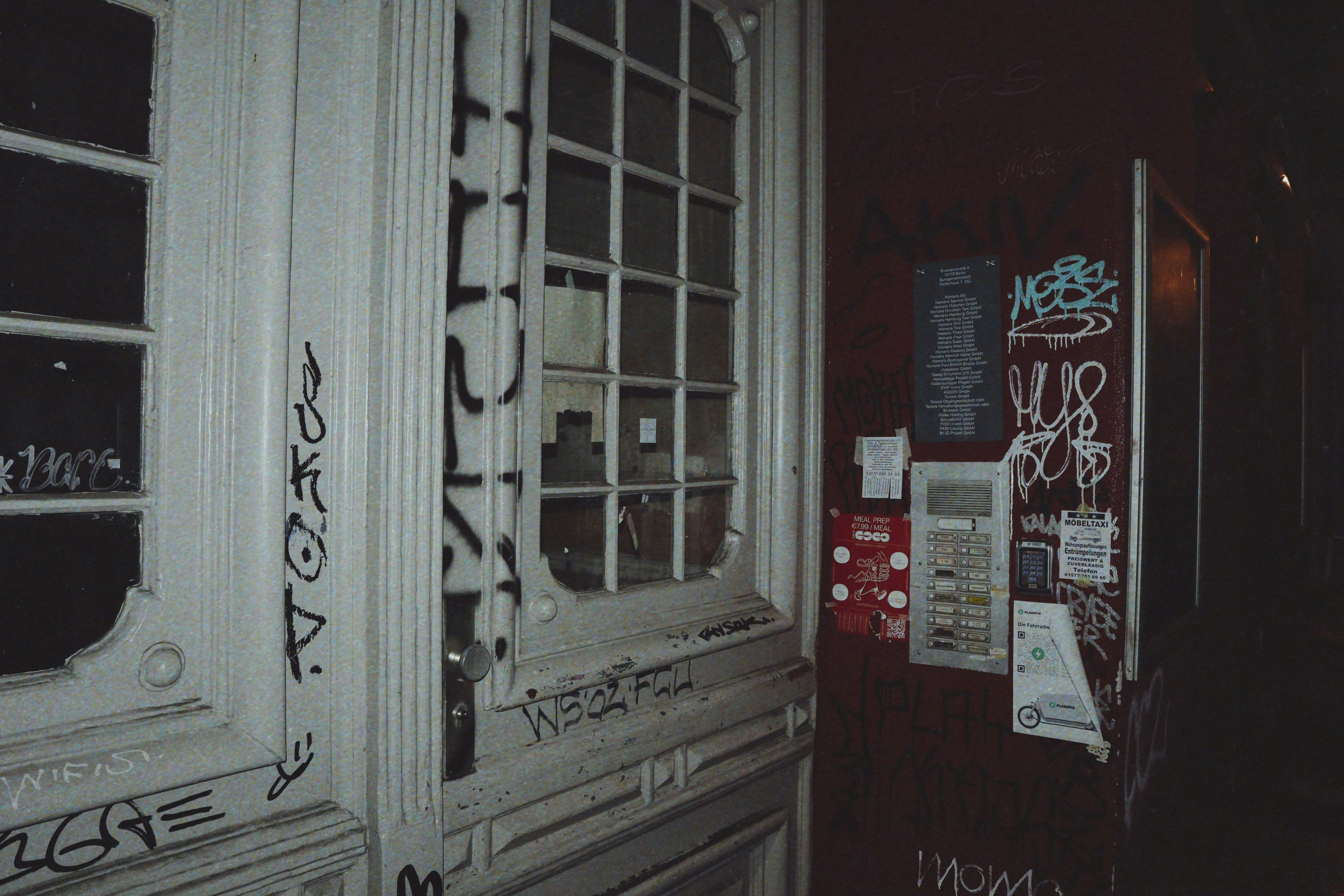 Midnight Doorway: Graffiti-Woven Portal in a Shadowed Alley