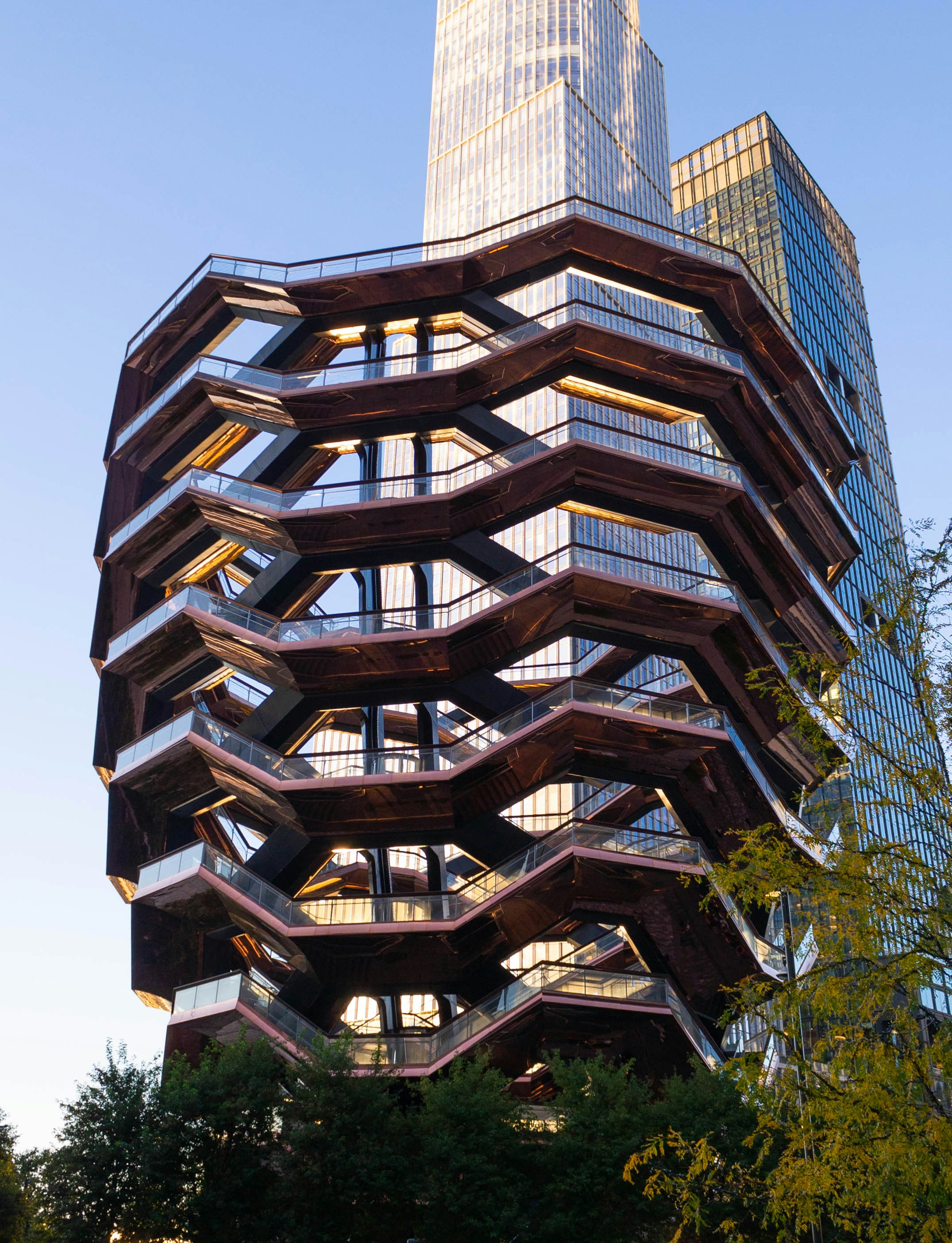 A tall building with trees in front of it photo – Free Hudson yards ...