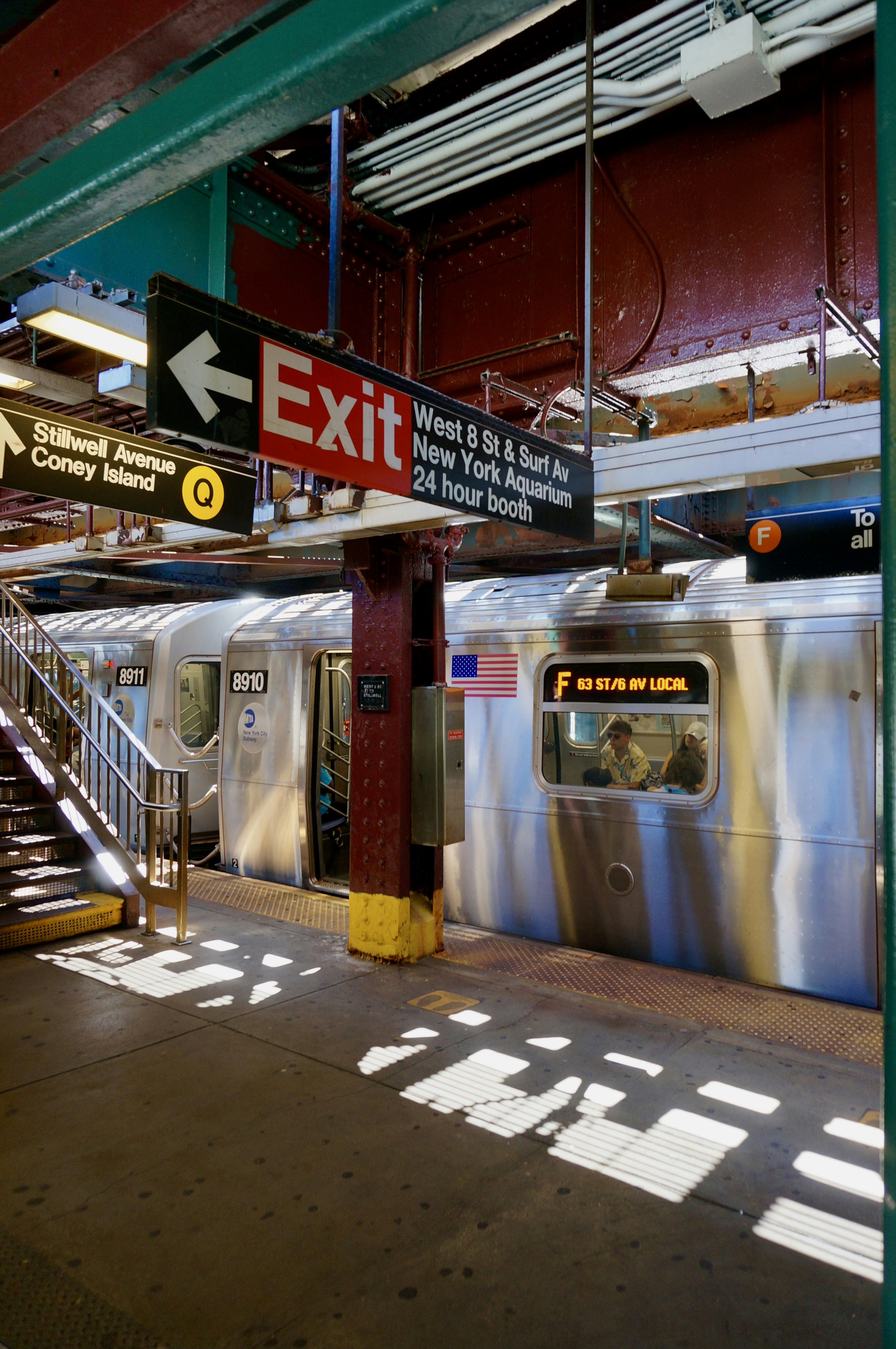 EXIT Arrow and Stainless Steel Train: A Subway Platform in Motion