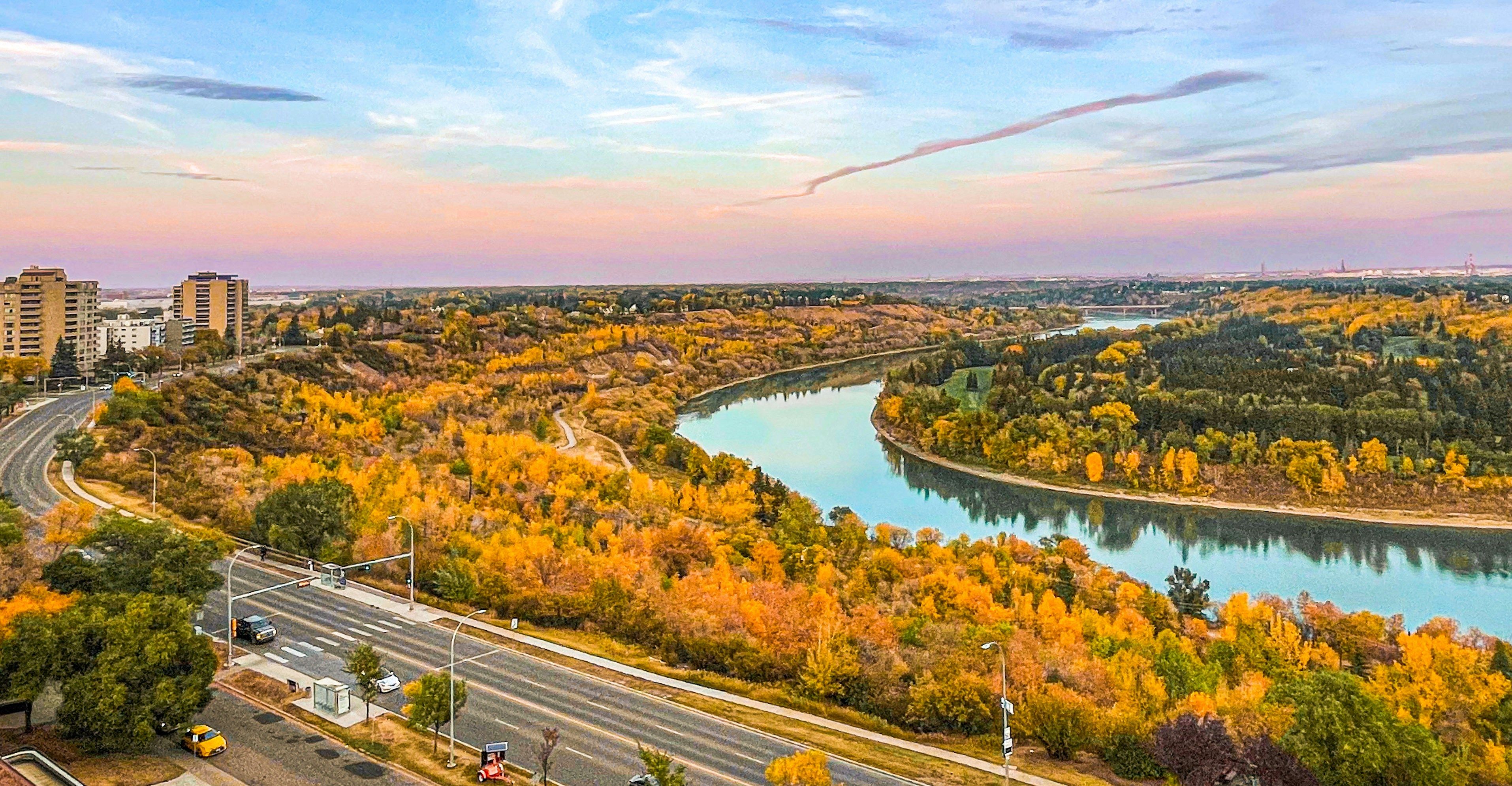 Autumn Riverbend Overlook: Sunset Light Weaves Through City and Creek
