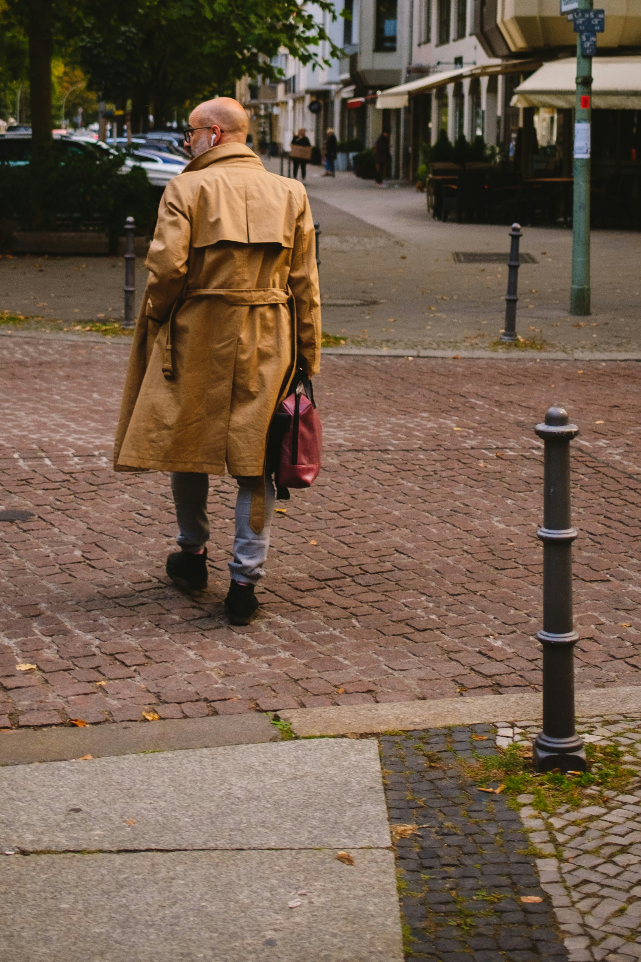 a person walking down a sidewalk