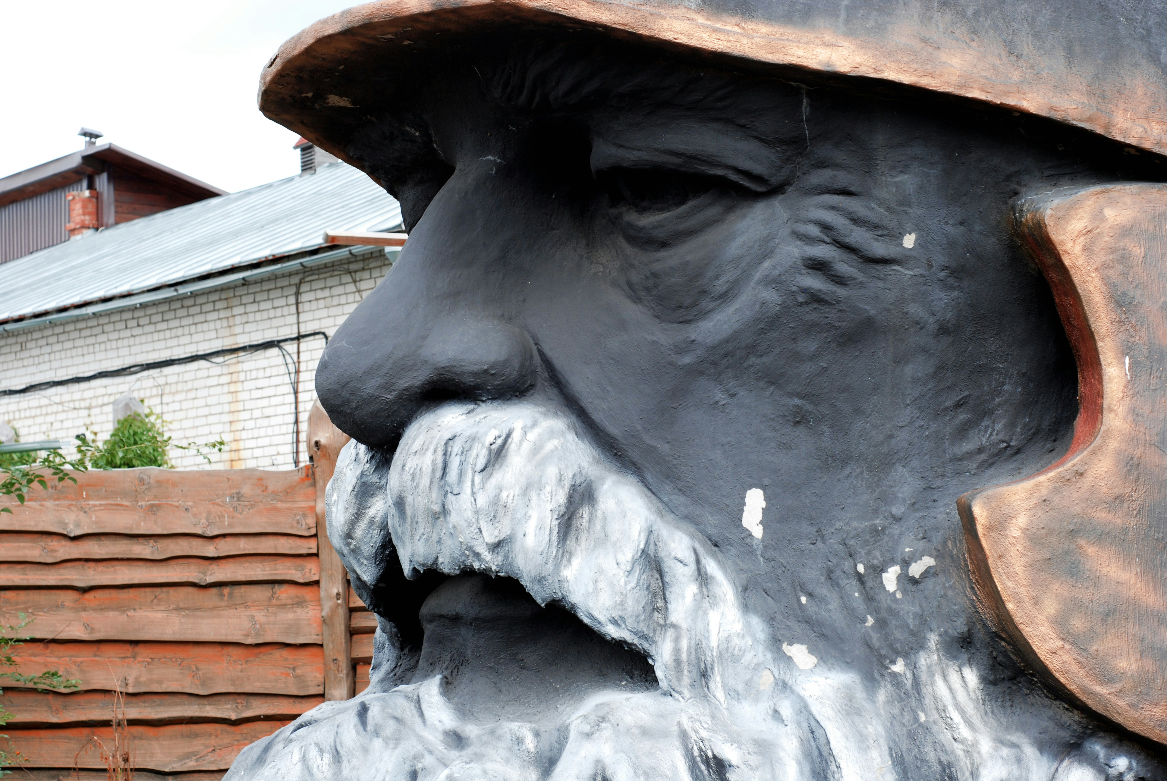 Weathered Guardian: A Venturous Stone Portrait in Soft Light