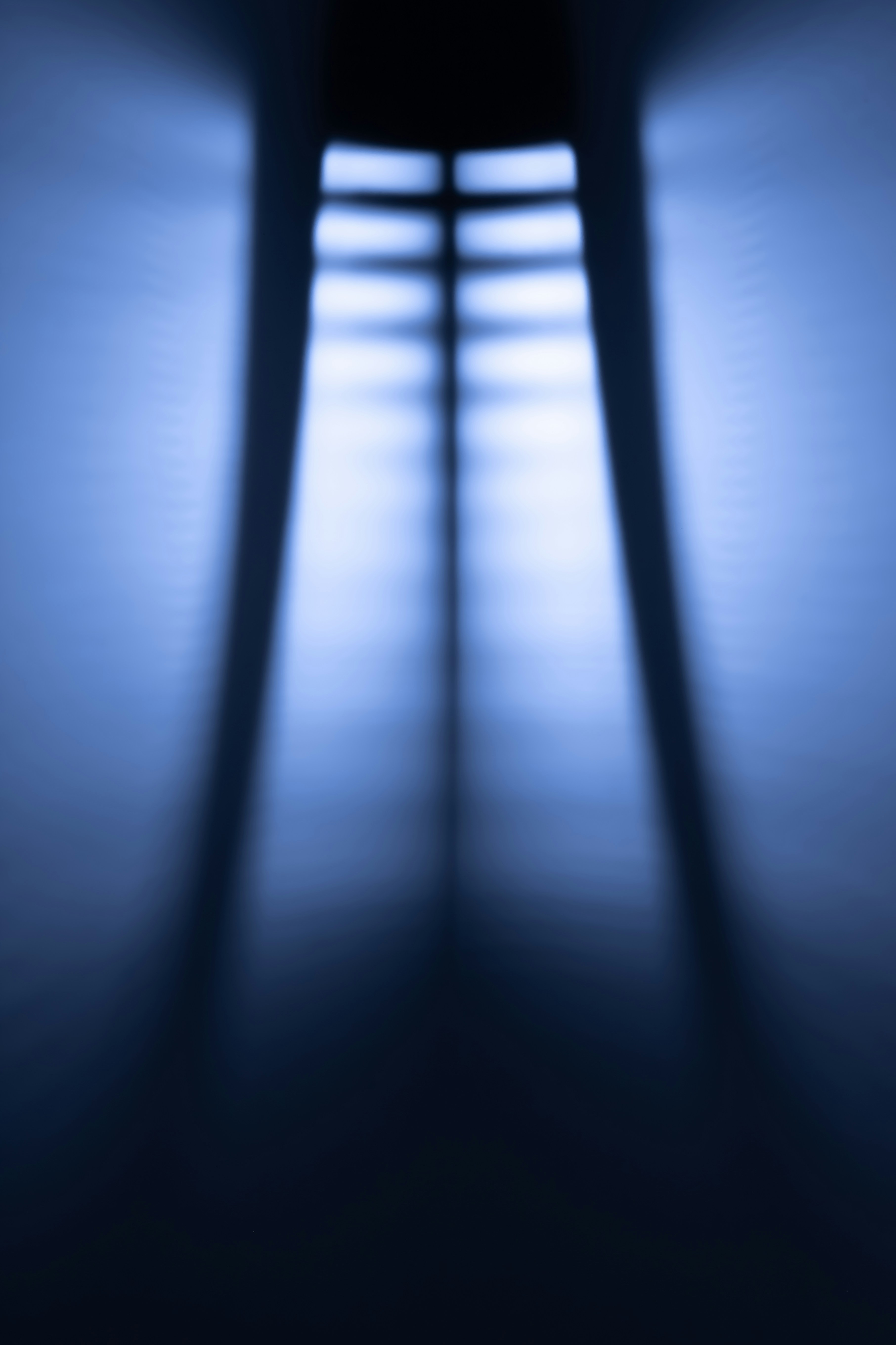 Blue Lattice Corridor: Soft Blur Through Striped Light