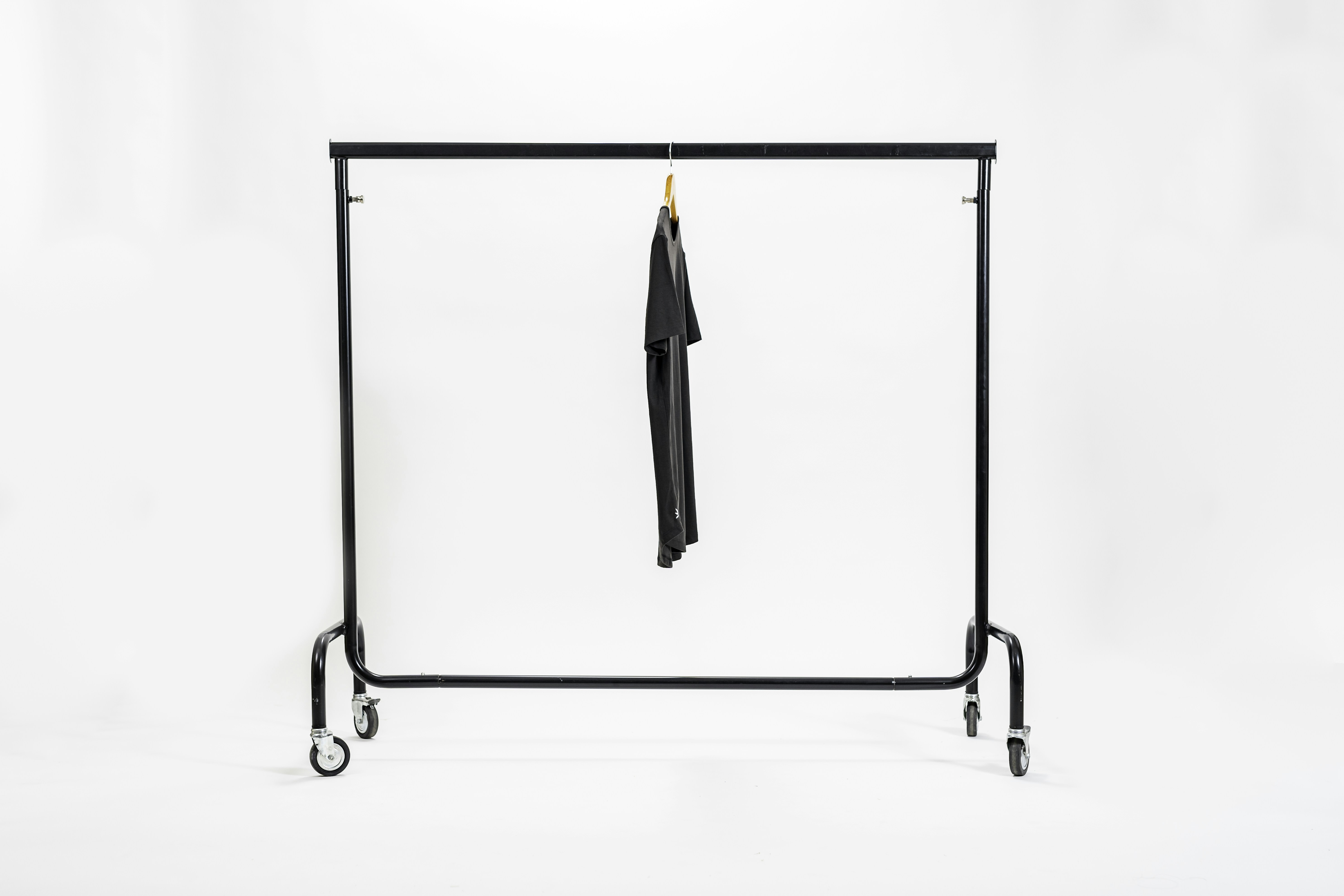 Minimal Wardrobe Stand with a Folded Garment