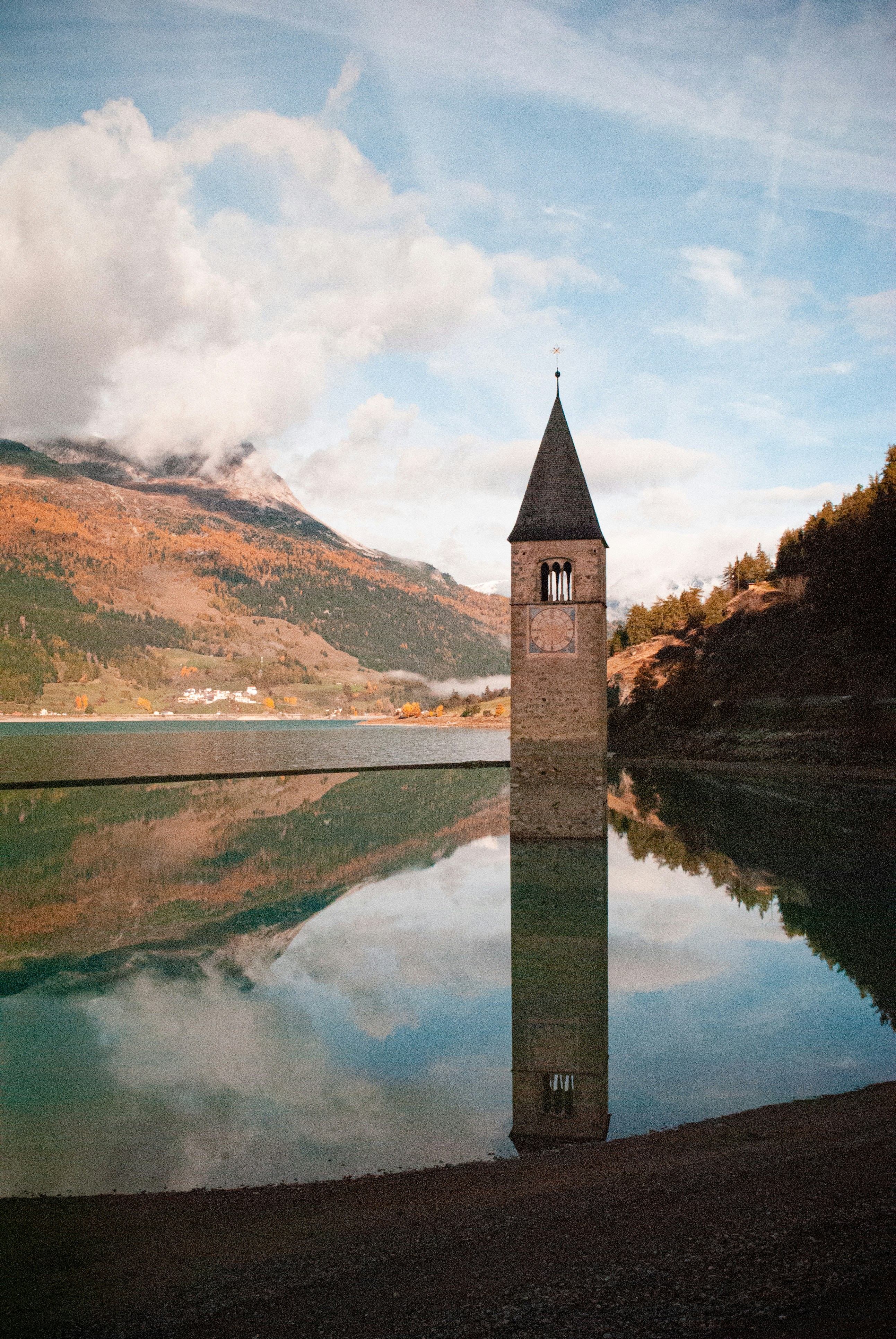 Alpine Bell Tower Reflected in a Glassy Lake