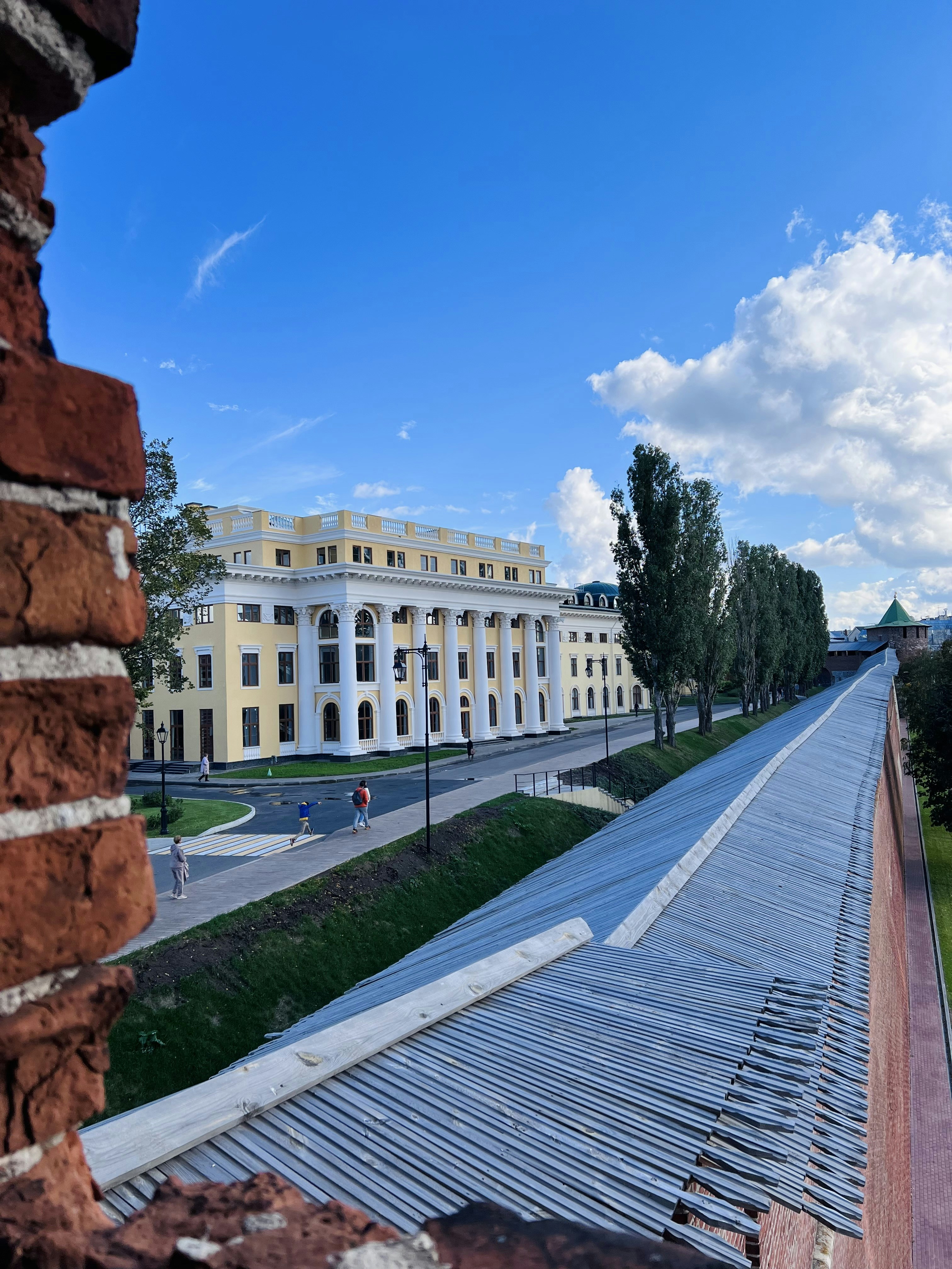 Through the Brick Frame: A Glimpse of Neoclassical Elegance