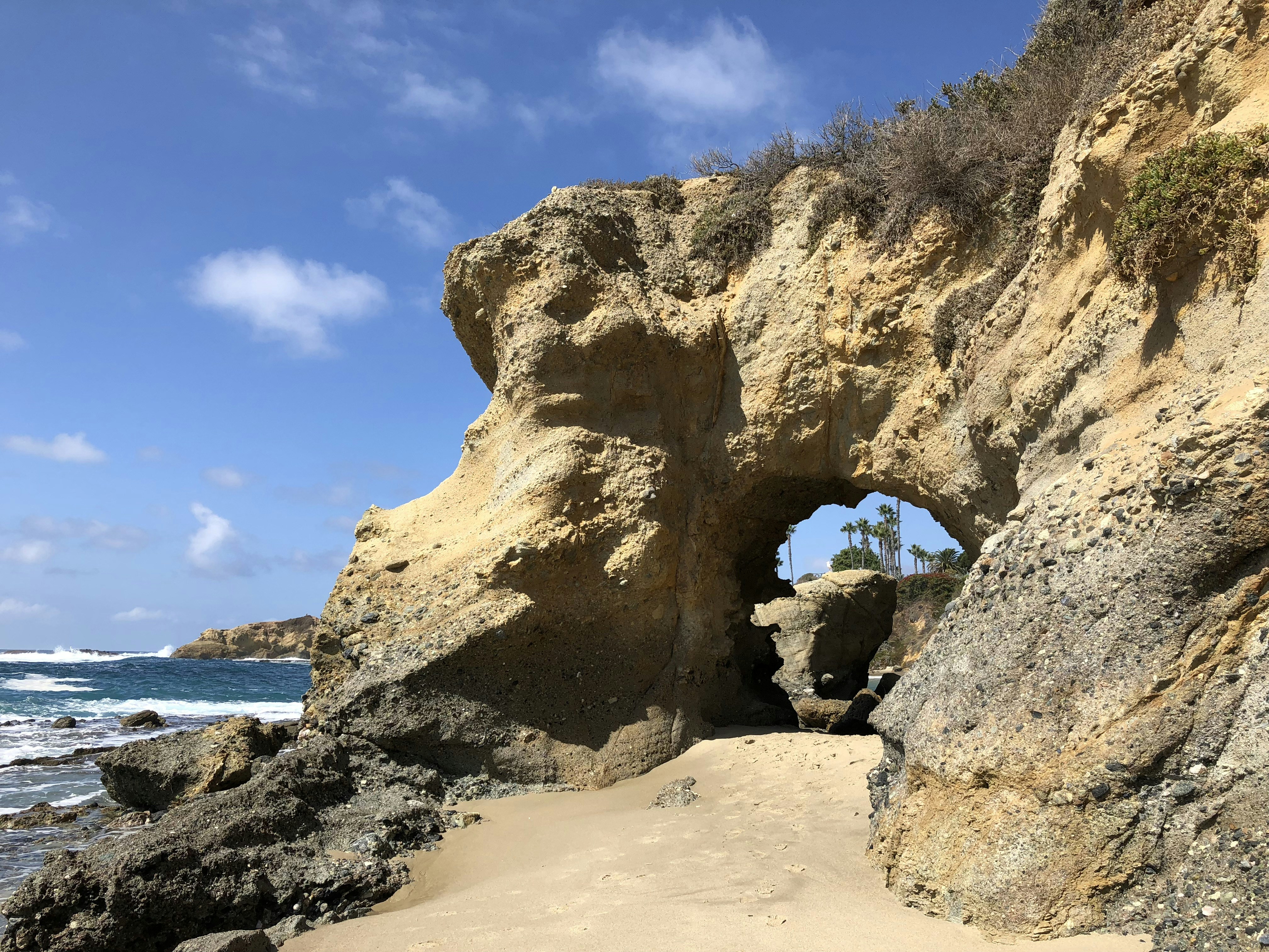 Sunlit Sea Arch: A Golden Corridor to the Quiet Beach