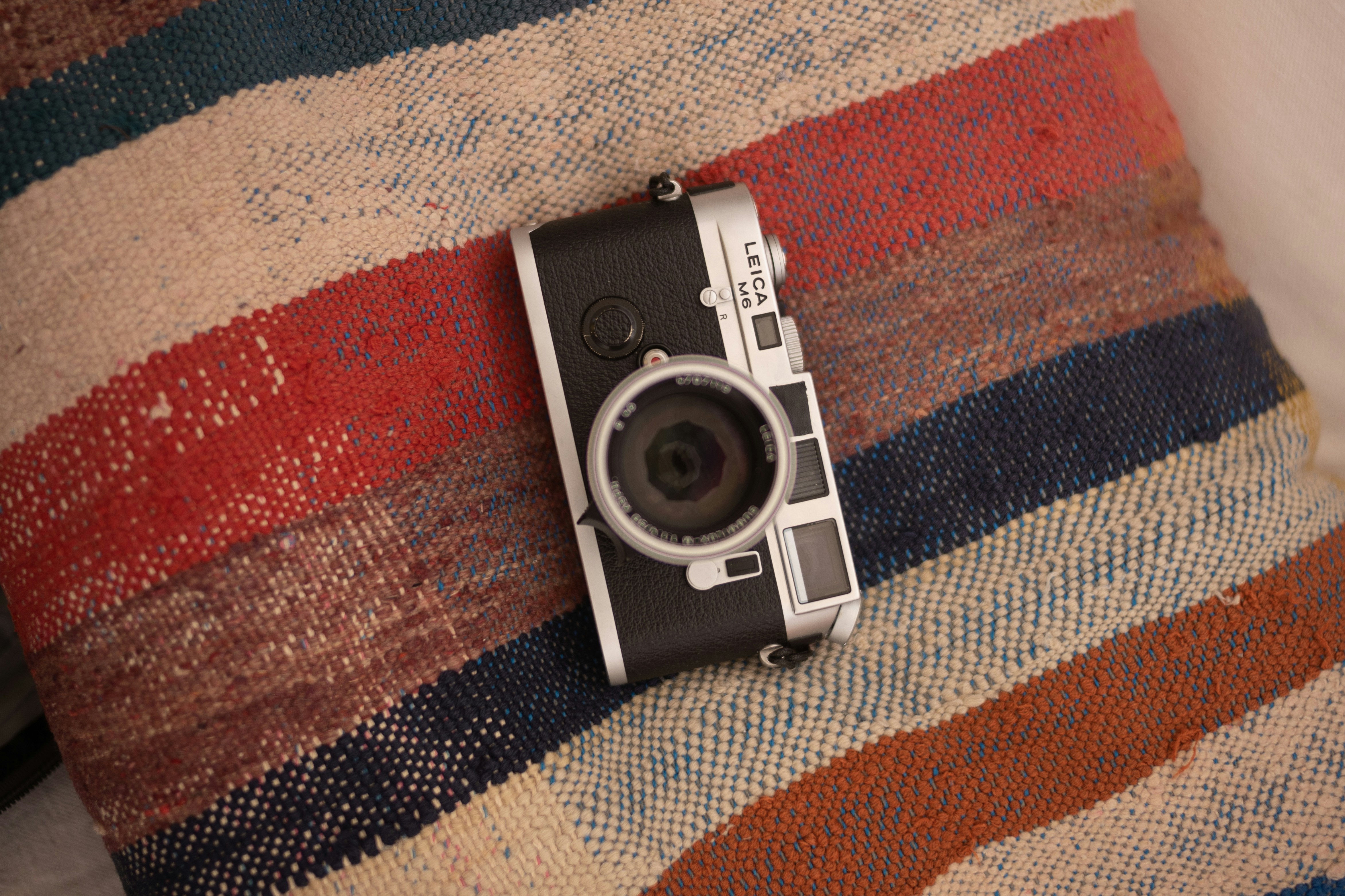 Vintage Compact: A Retro 35mm on a Striped Carpet