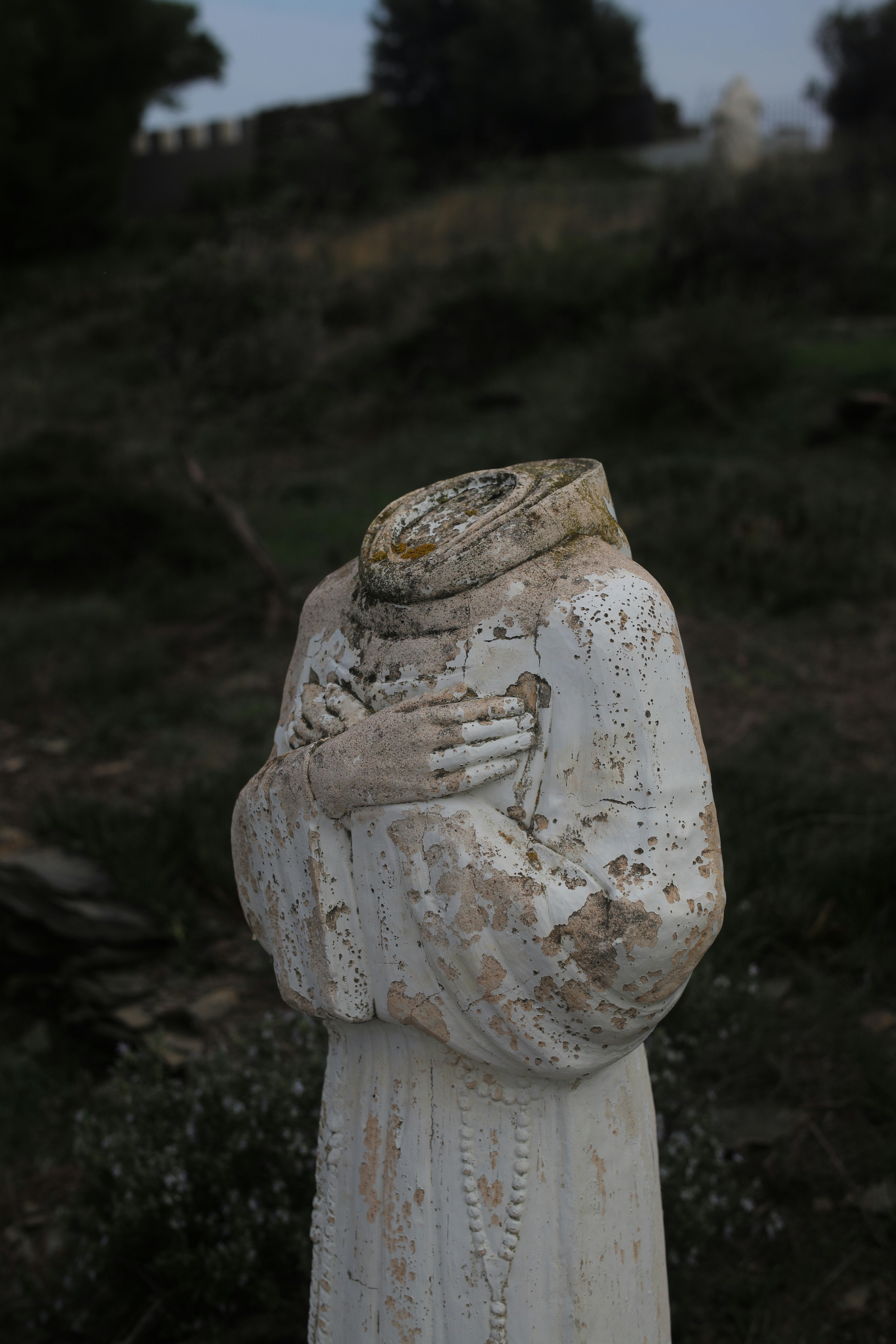 Headless Saint in Weathered Robes