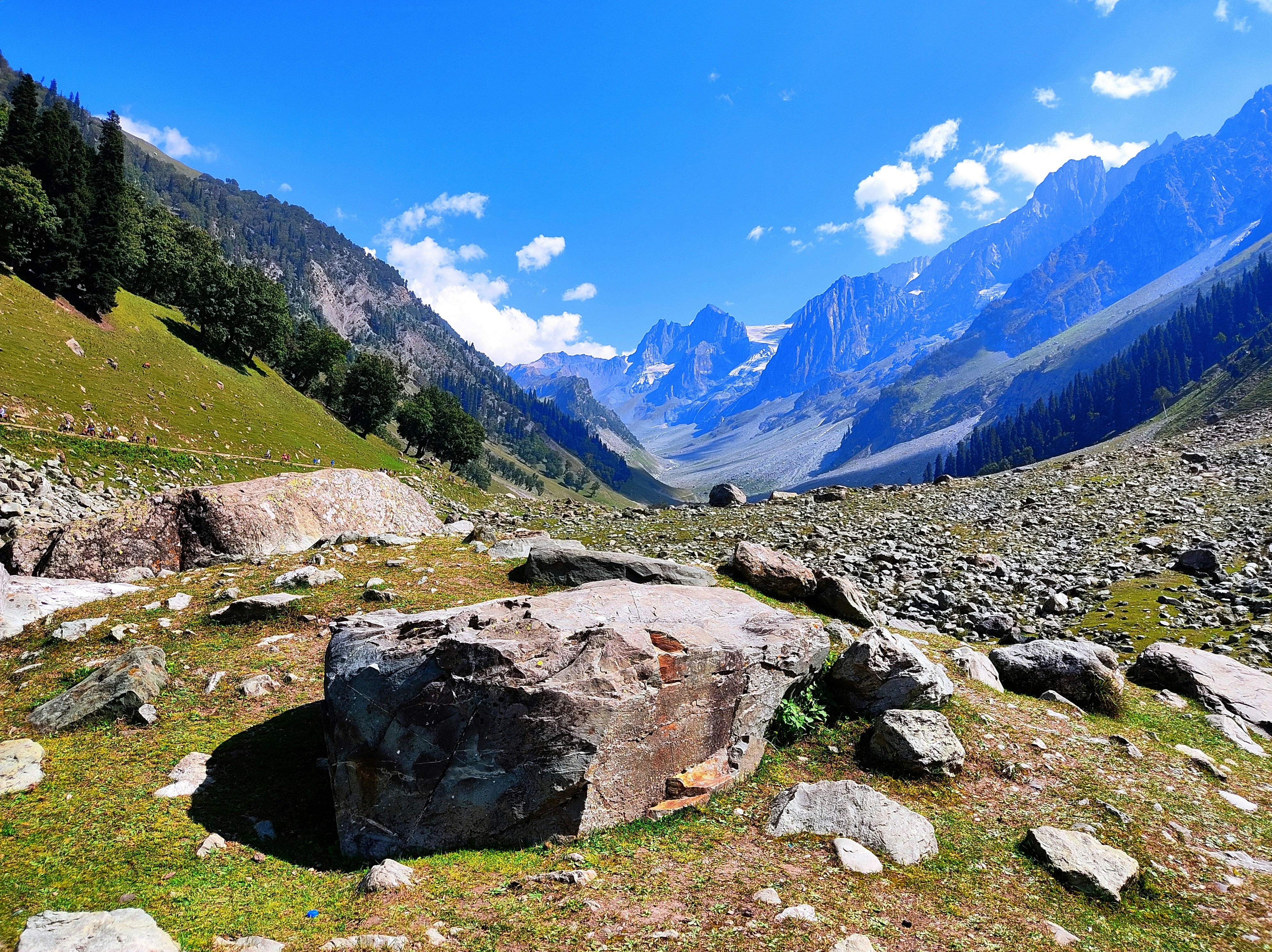 Beautiful landscape of mountains with clouds view in blue sky and snow on the peaks