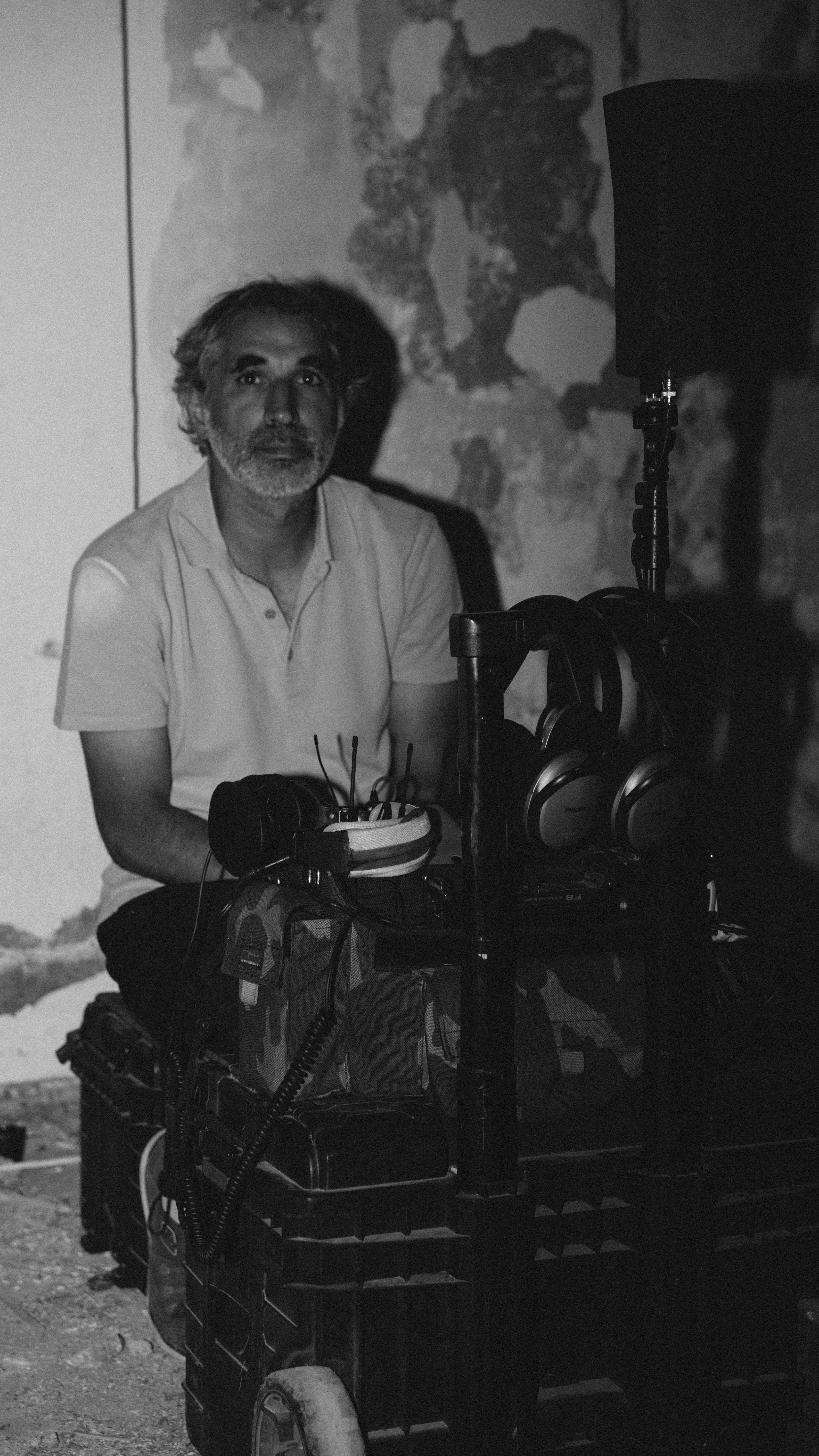 Rusted Walls, Quiet Focus: Portrait Amid Gear